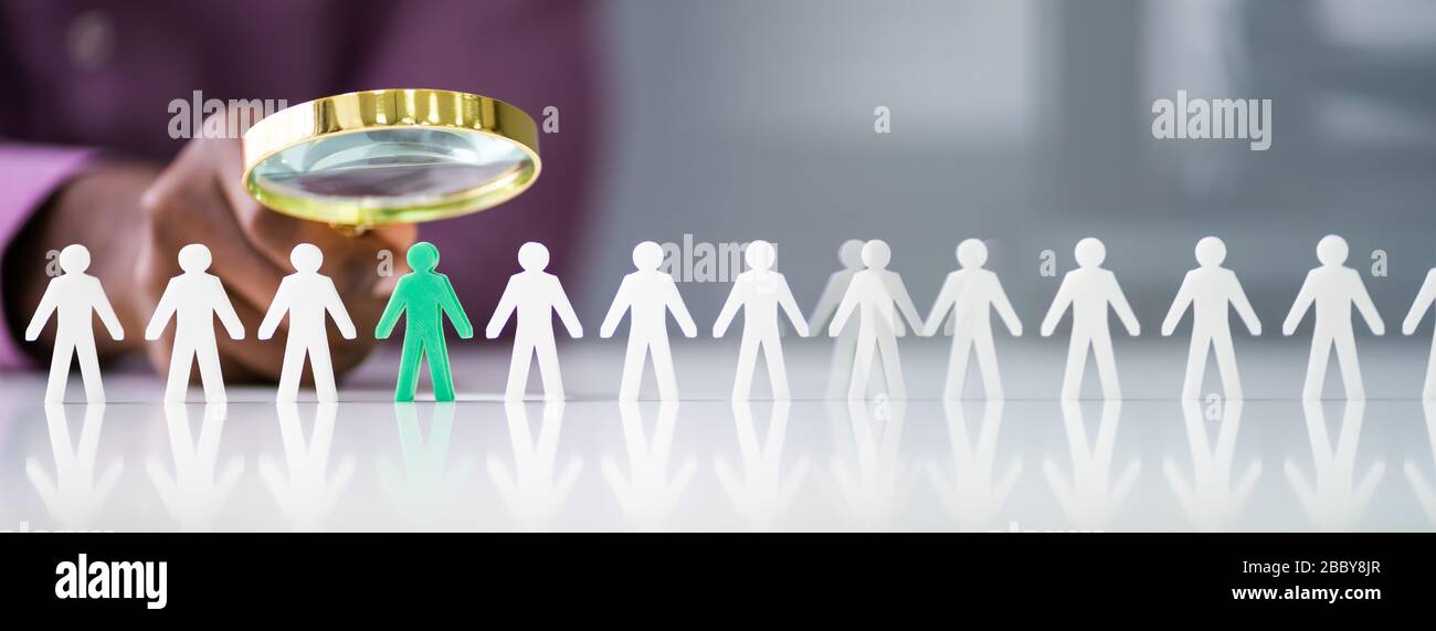 Close-up Of A Person Examining The Plastic Figures With Magnifying ...