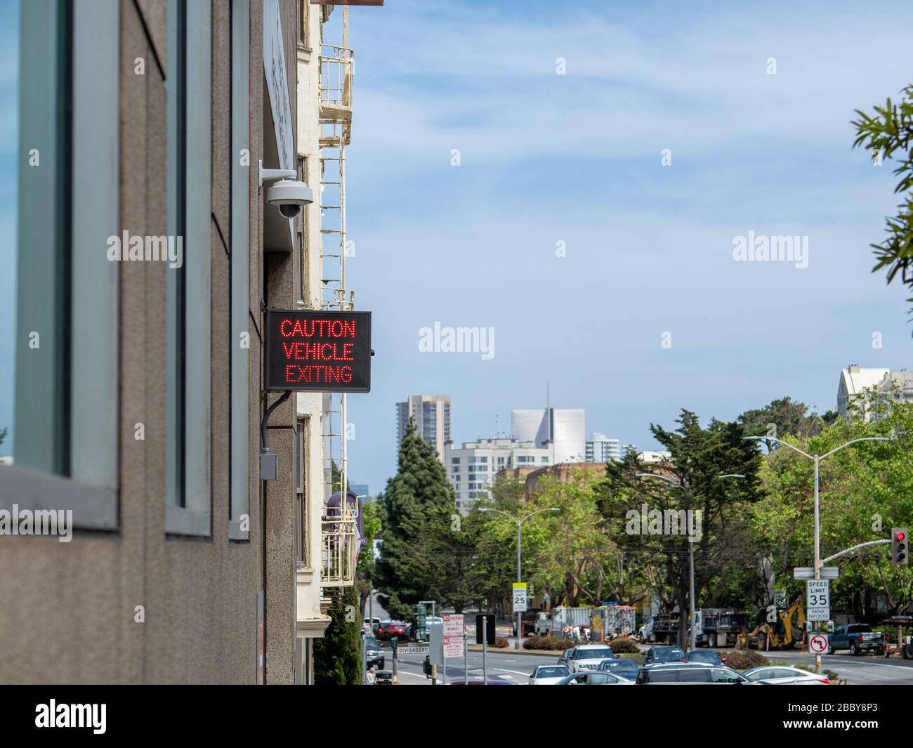 Caution vehicle exiting illuminated sign outside of underground parking ...