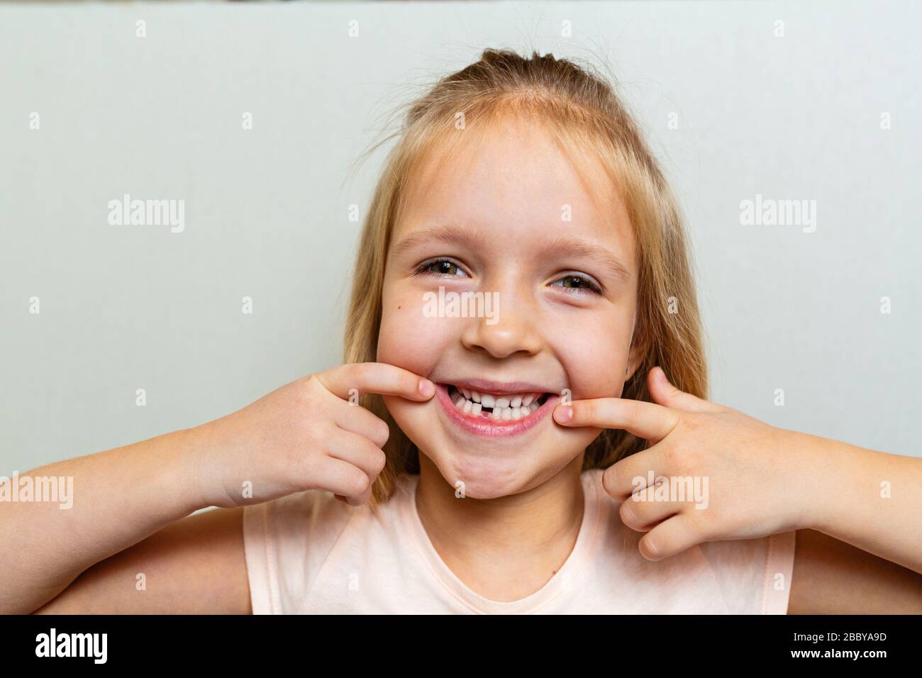 Kid showing the first milk tooth. Change teeth concept. Cute little ...