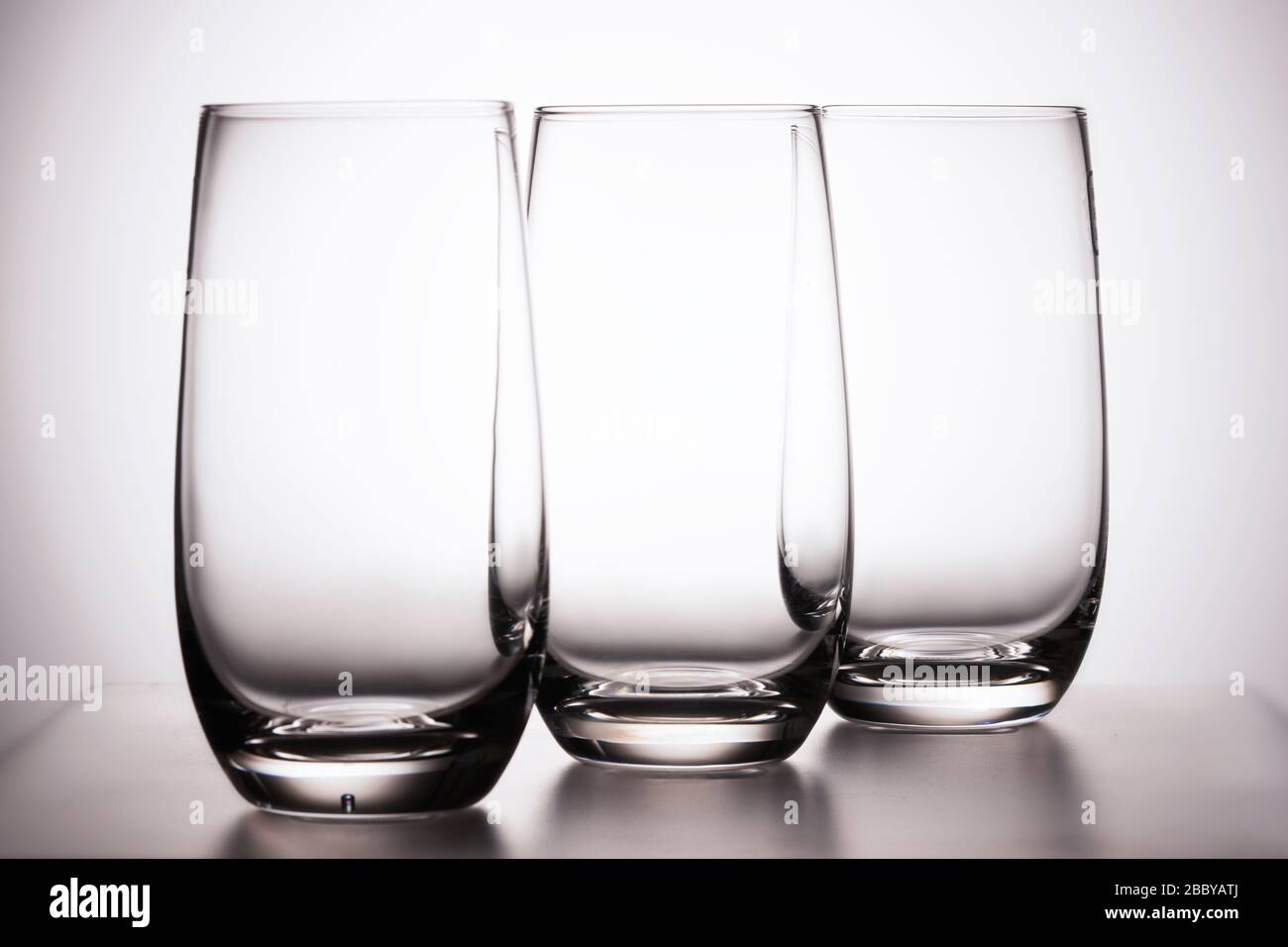 Three empty glass hi-res stock photography and images - Alamy
