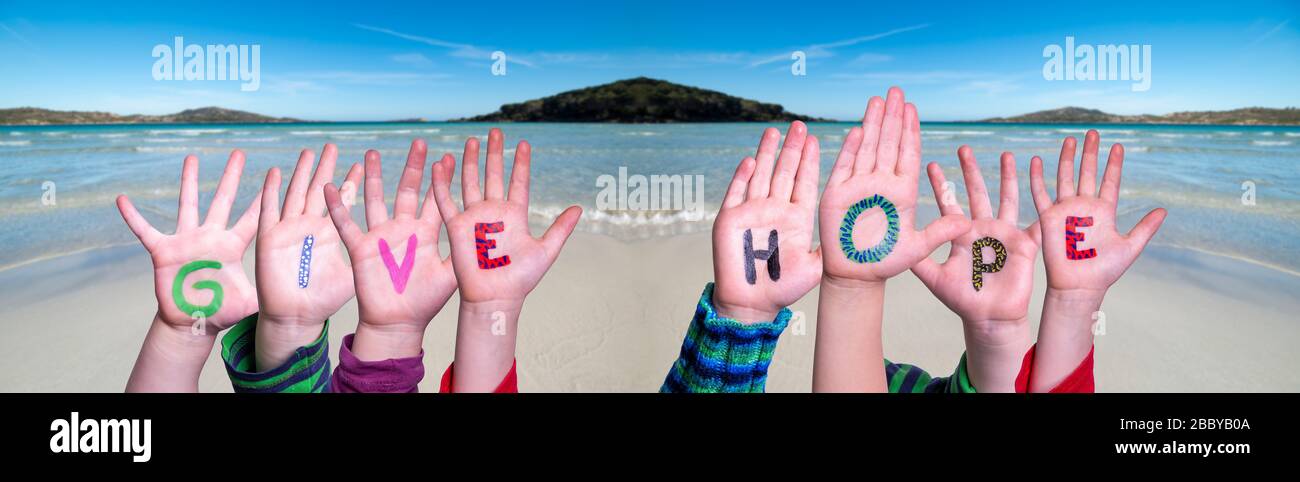 Children Hands Building Word Give Hope, Ocean Background Stock Photo ...