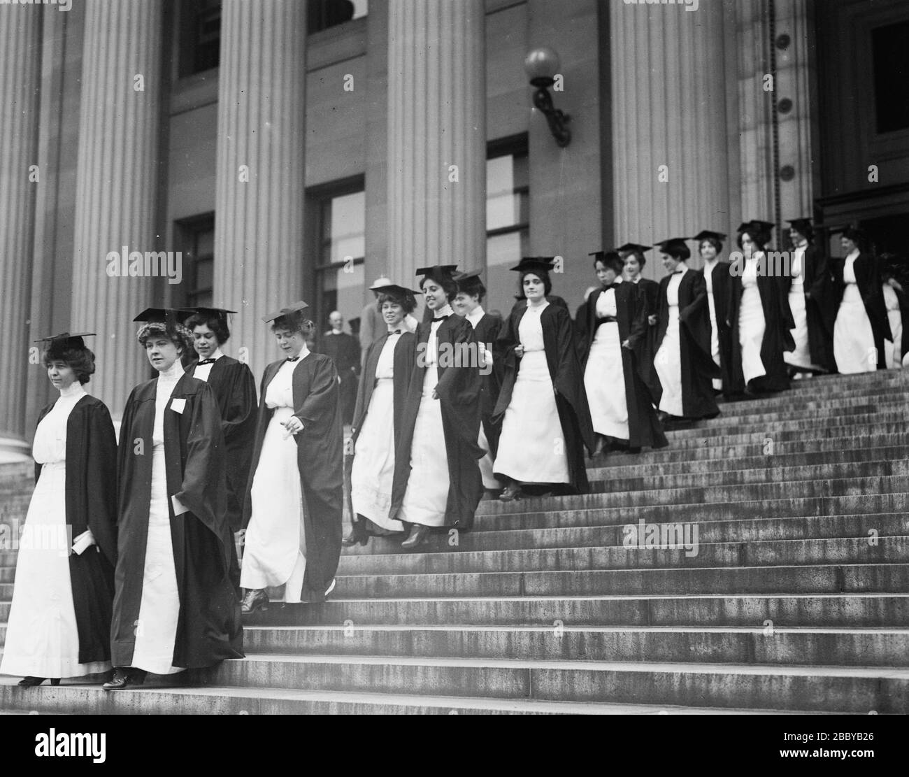 Female students walking down steps in caps and gowns - Barnard College ...