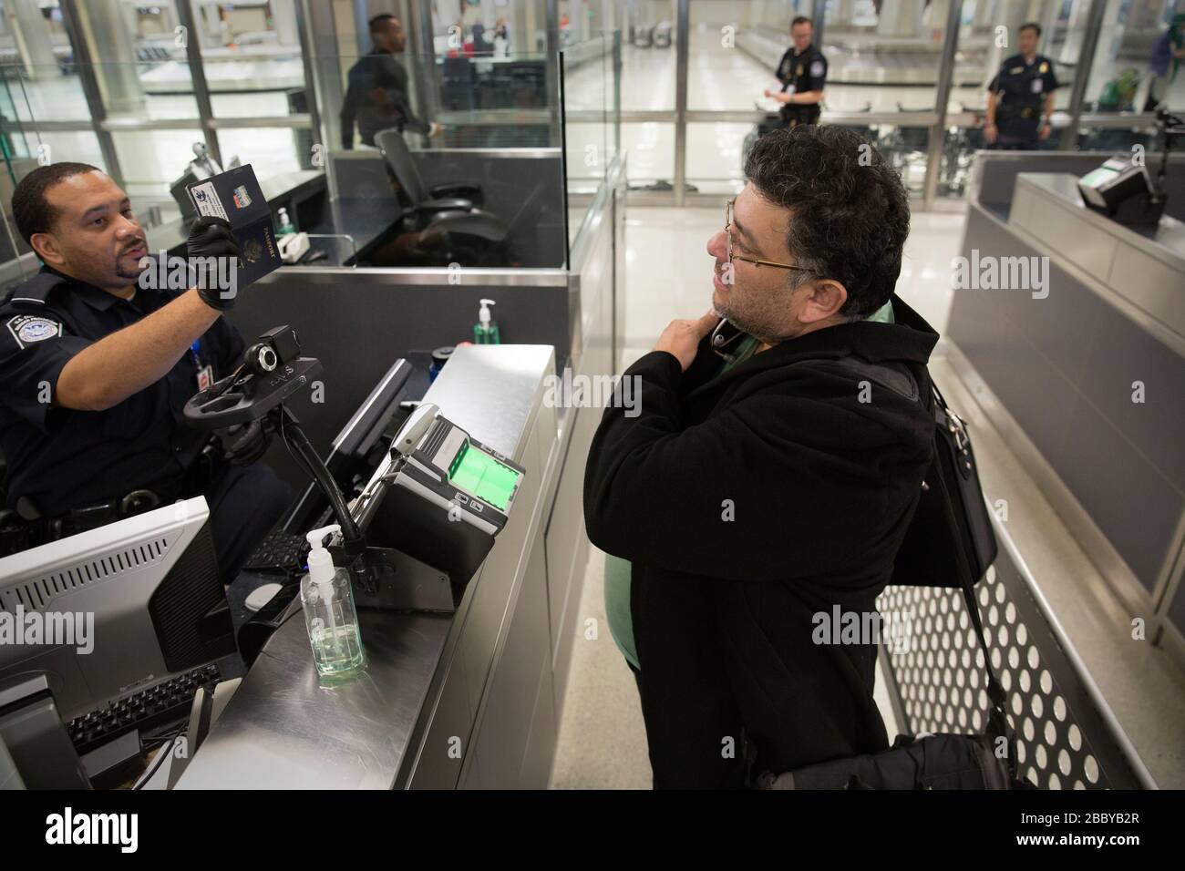 U.S. Customs and Border Protection officers screen international ...