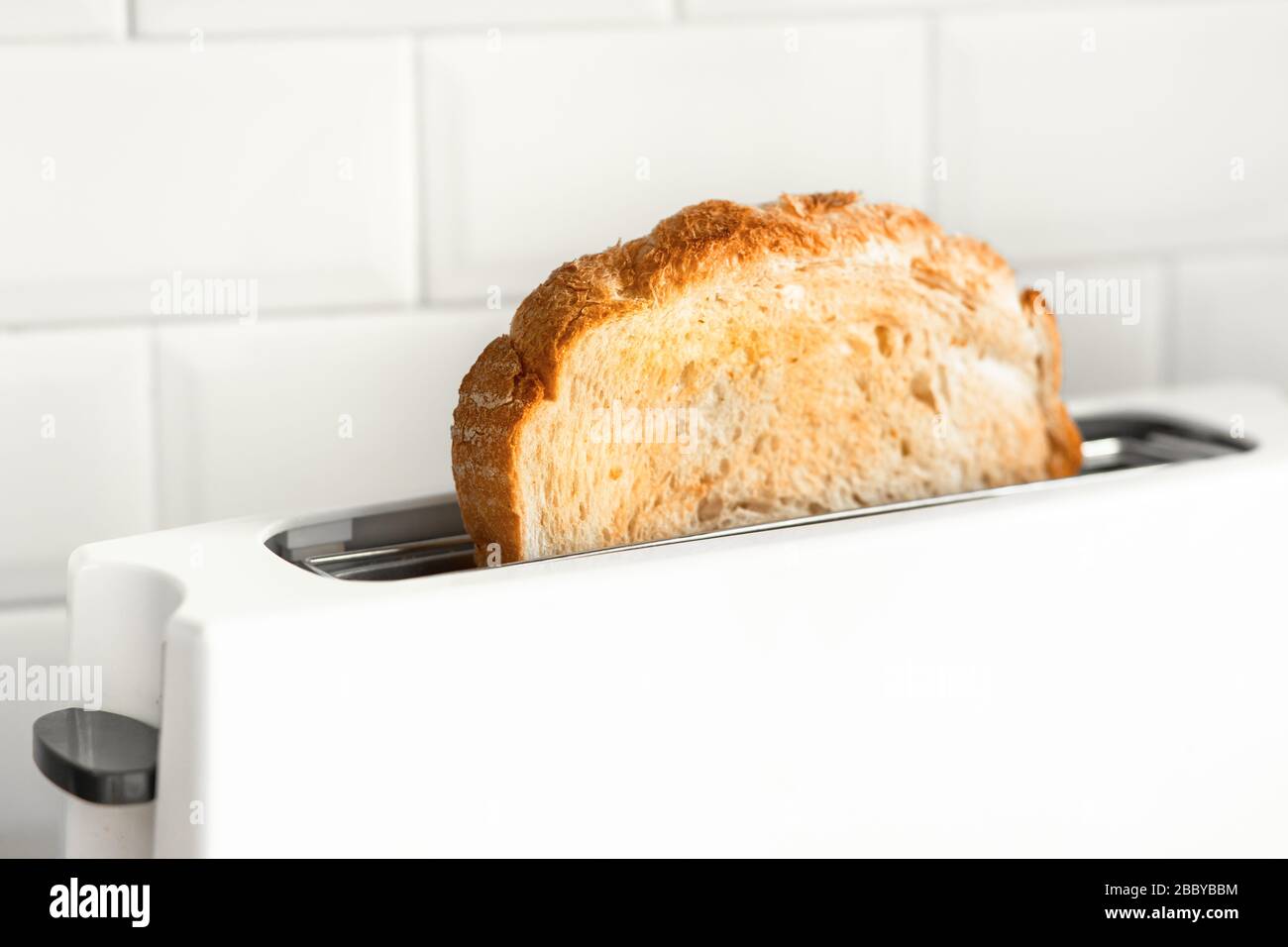 Closeup cooking bread with toaster on counter bar kitchen in morning ...