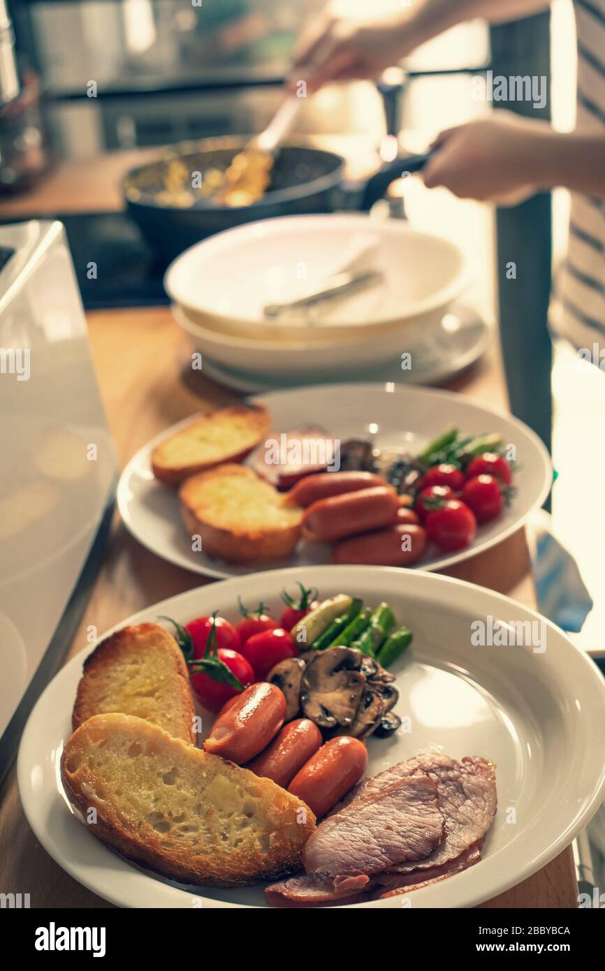 Female cooking breakfast on kitchen counter bar.Healthy food,simple ...