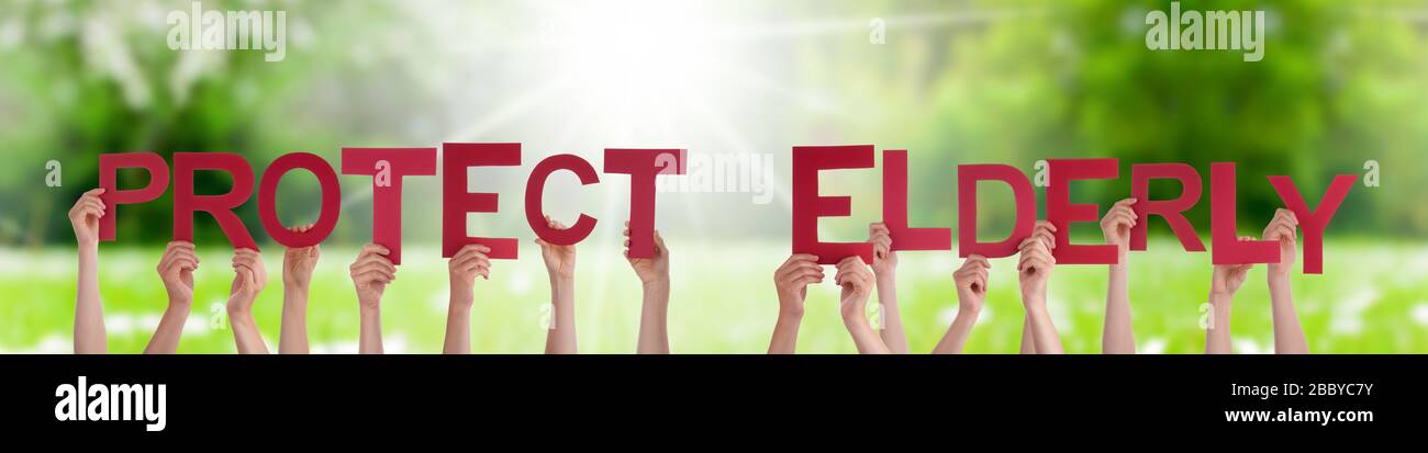 People Hands Holding Word Protect Elderly, Grass Meadow Stock Photo - Alamy