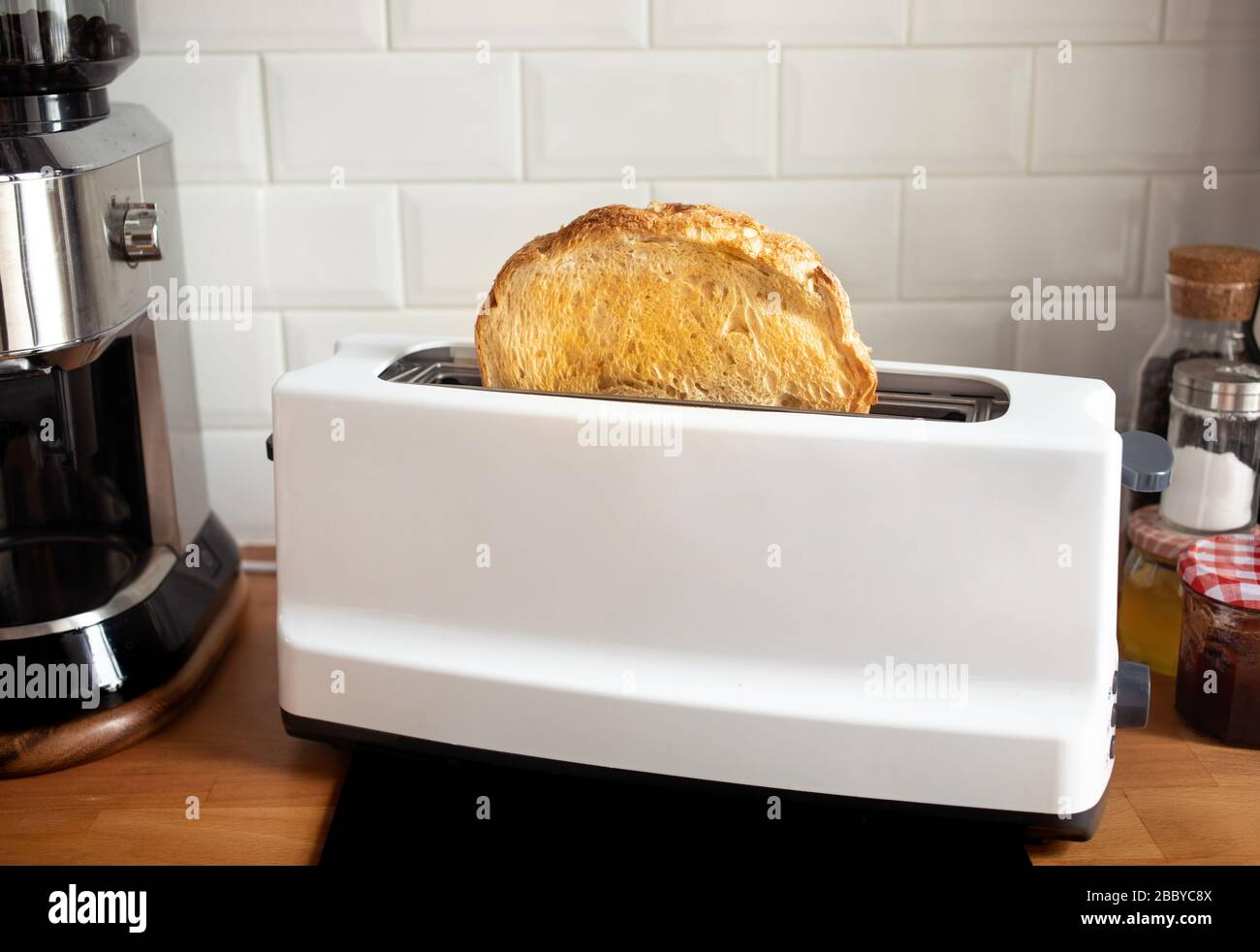 Closeup cooking bread with toaster on counter bar kitchen in morning ...