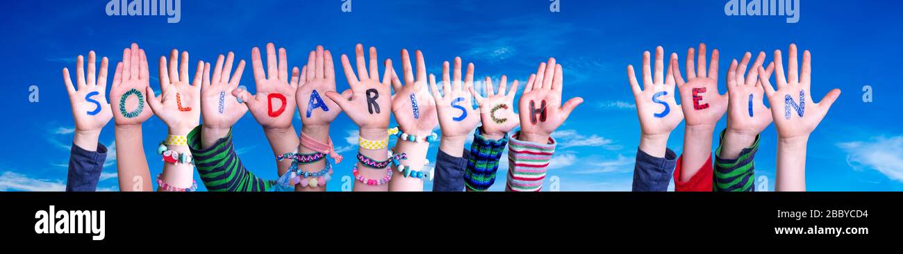 Kids Hands Holding Word Solidarisch Sein Means Showing Solidarity, Blue ...