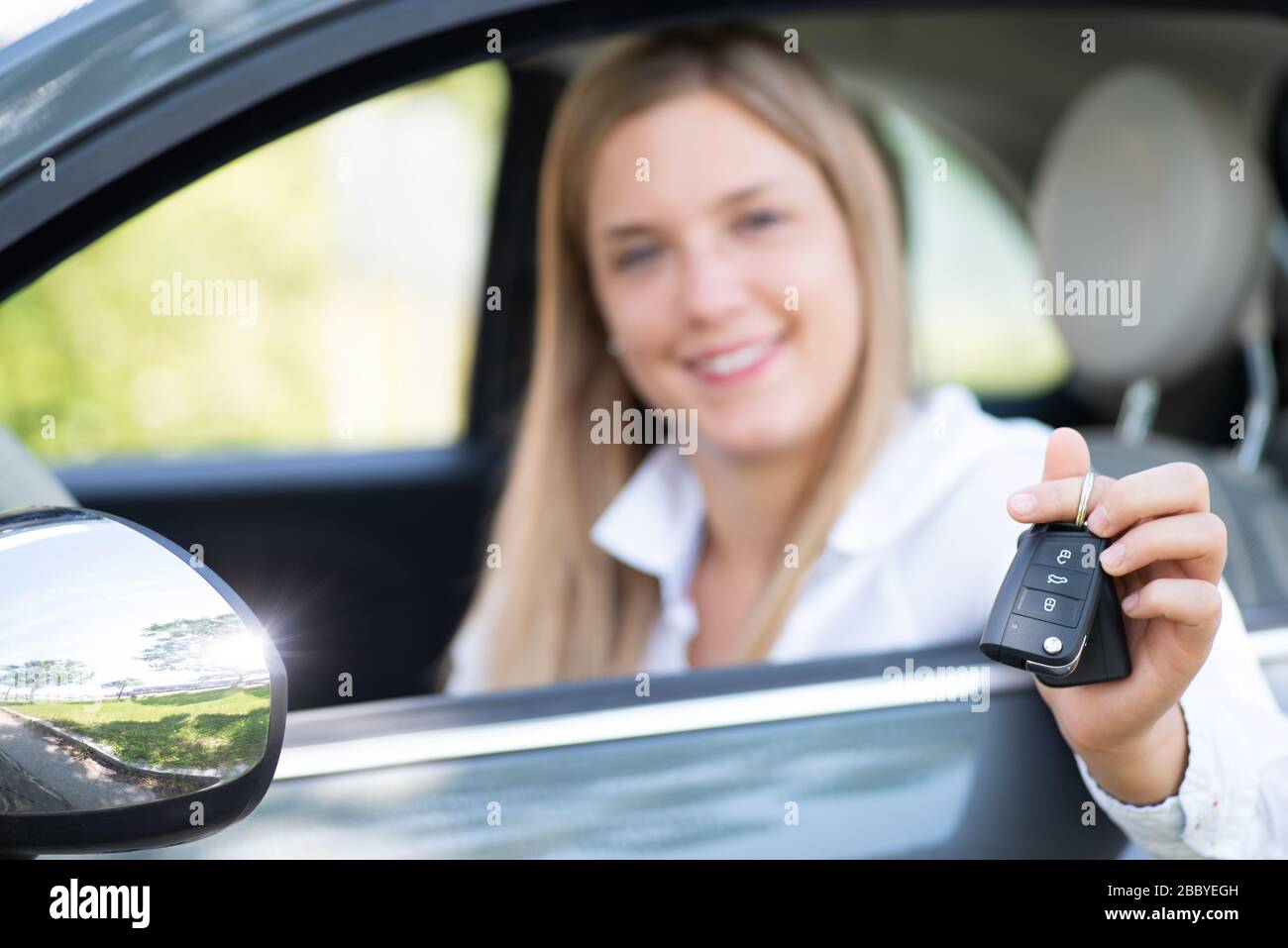 Woman with car keys and drivers license driving test hi-res stock ...
