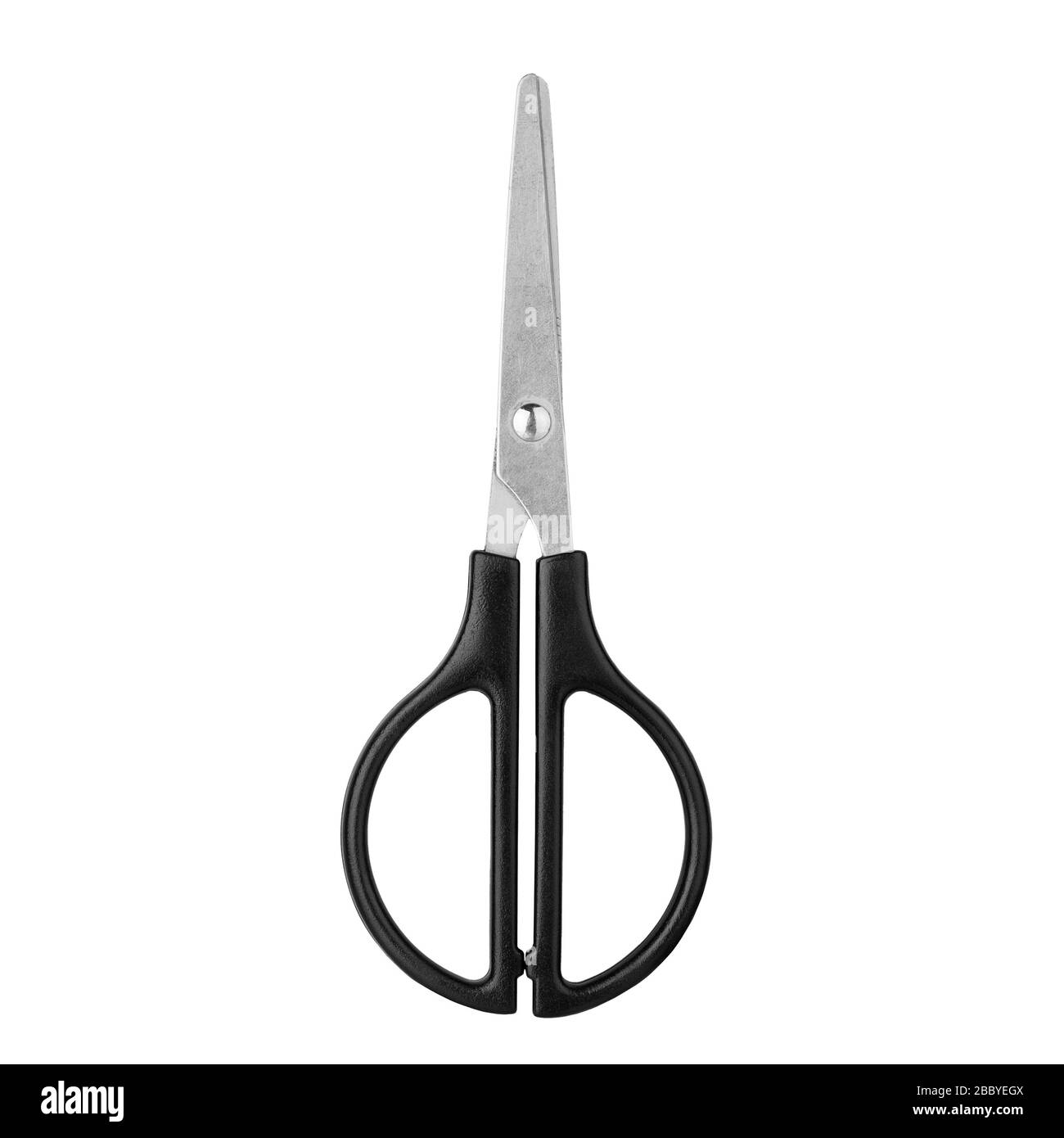 Silver metal closed scissors with black plastic handles on white ...