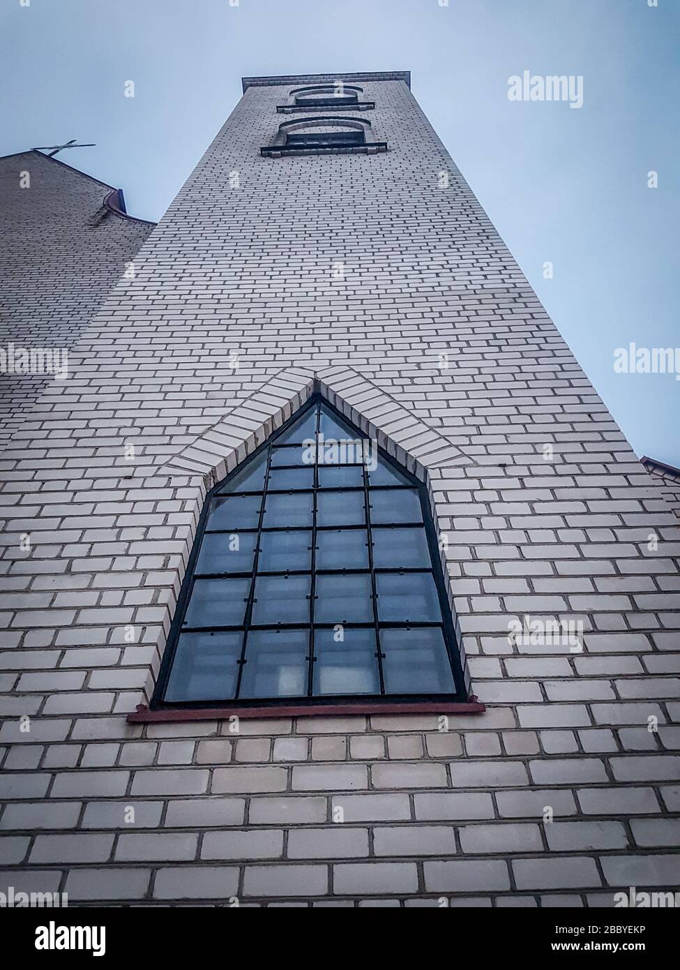 window on the wall of the Catholic Church Stock Photo - Alamy