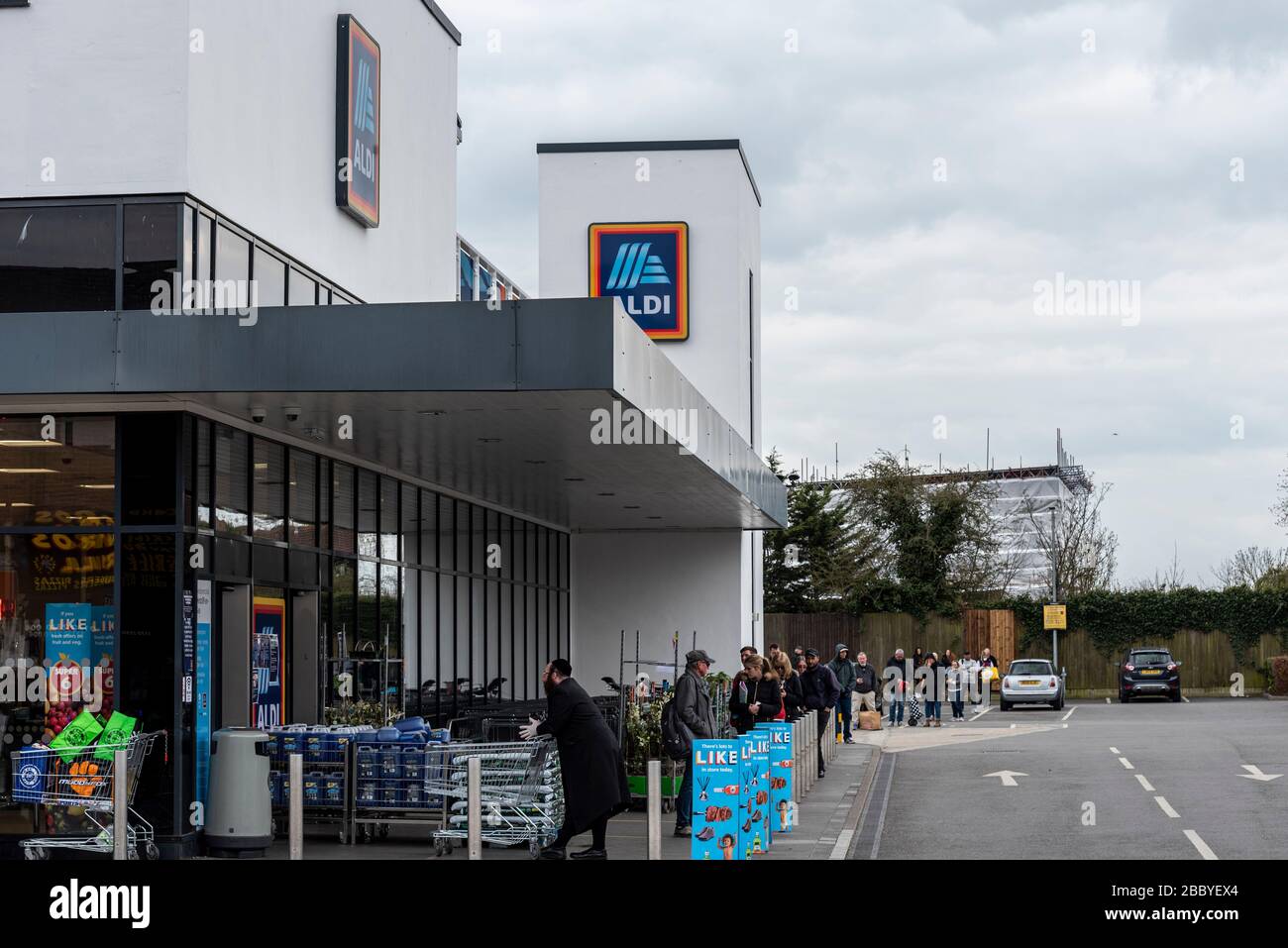 Shoppers queuing outside Aldi superstore in Westcliff on Sea during ...