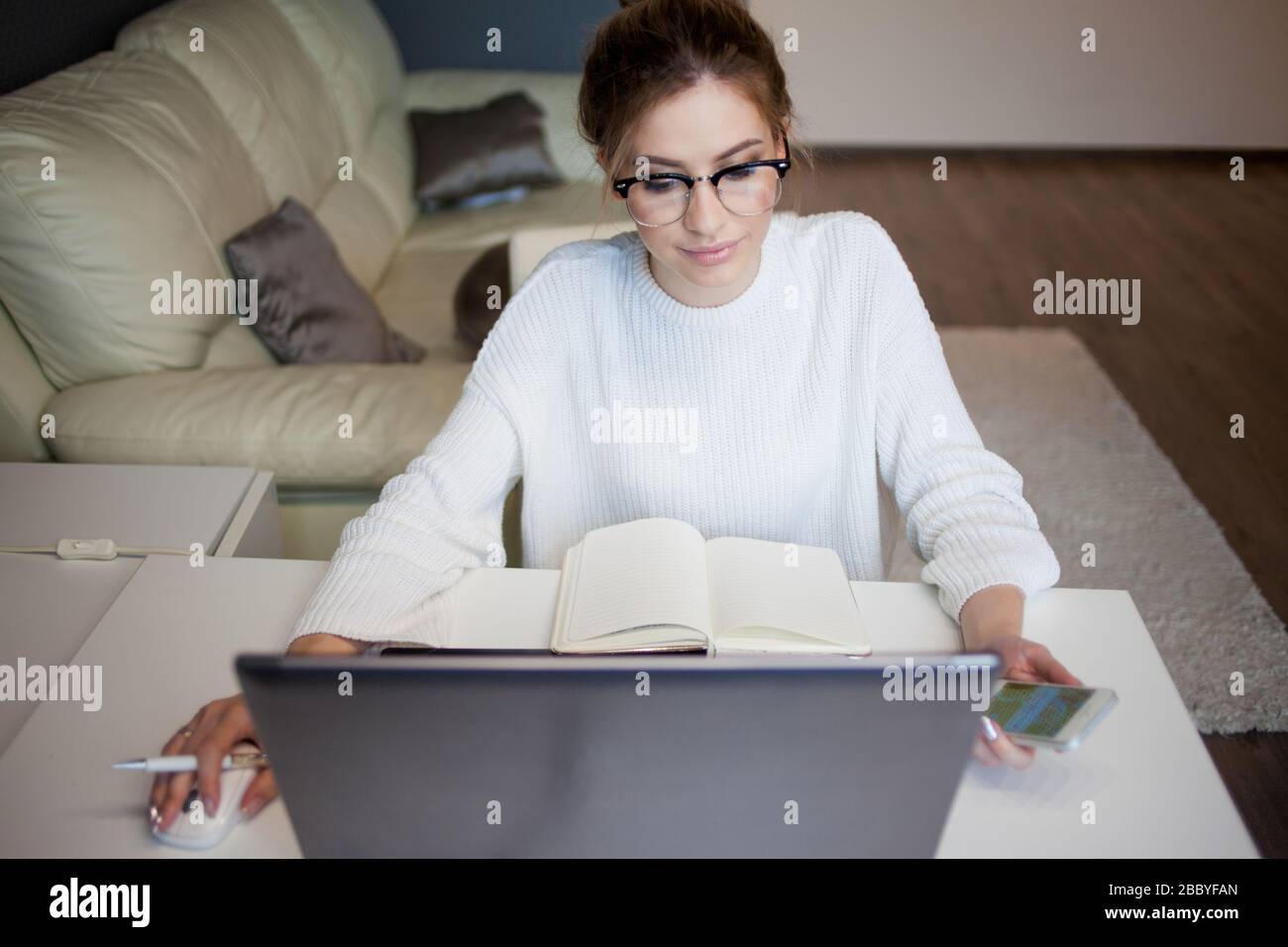 Remote communication and online work. Workplace at home. Young ...