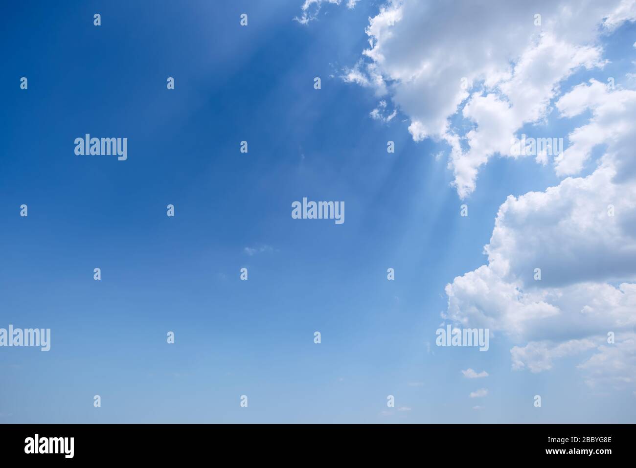 Beautiful rays of light in the sky from behind the clouds Stock Photo ...