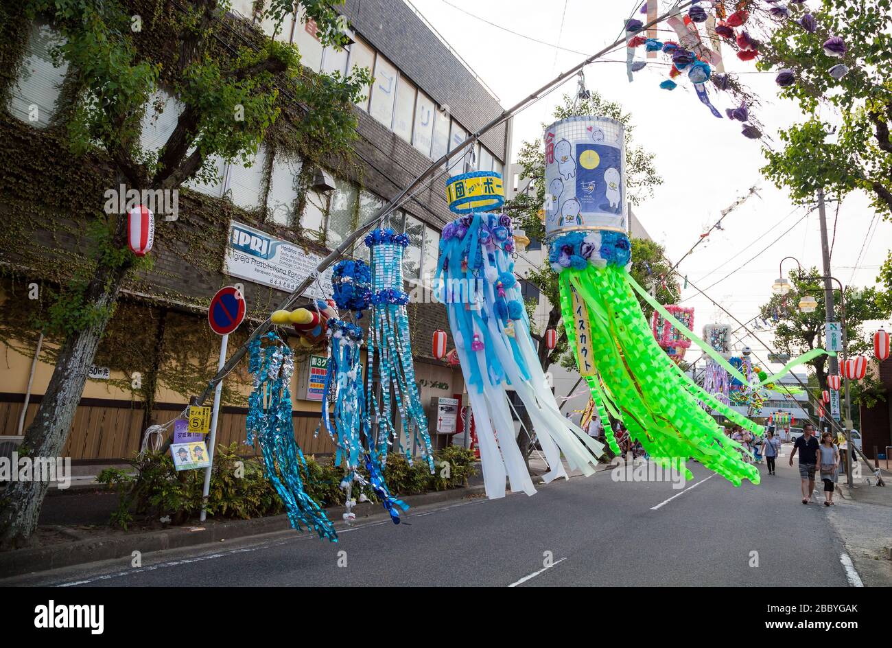 Traditional japanese paper decoration on bamboo poles. Anjo Tanabata ...