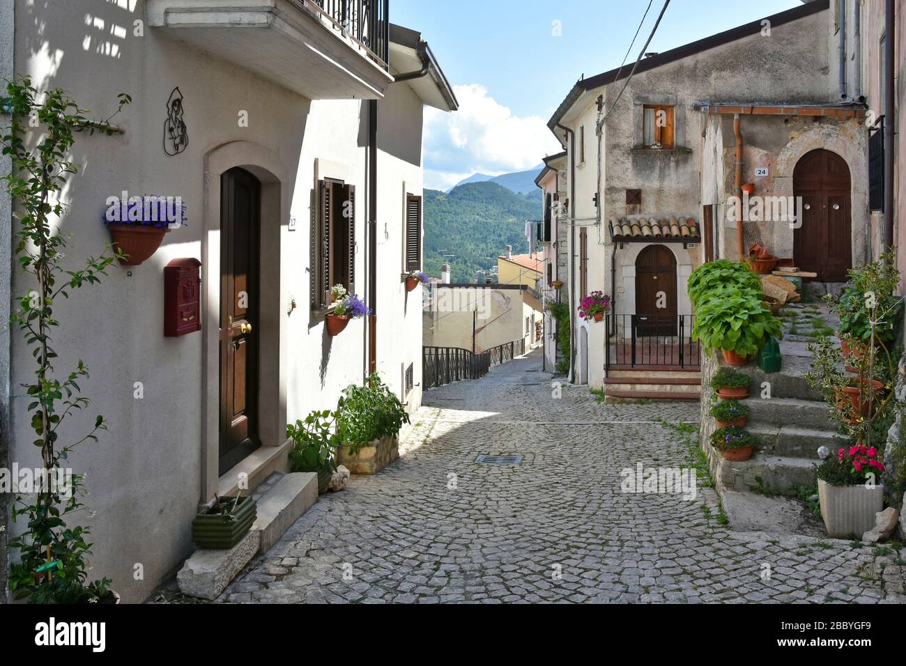 A narrow street between the houses of Scontrone, a village in the ...