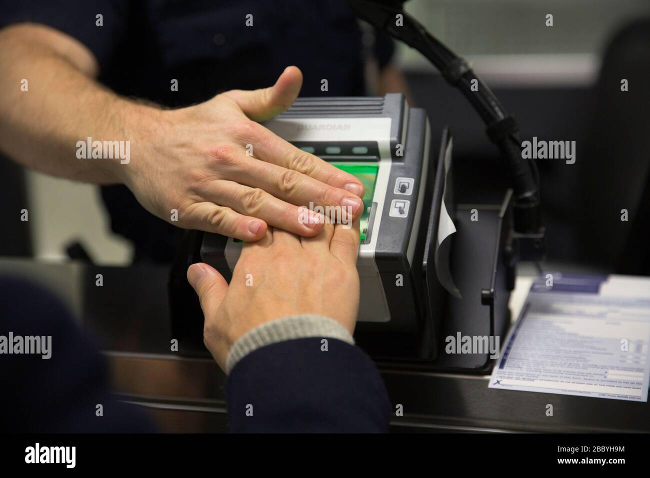 U.S. Customs and Border Protection officers screen international ...