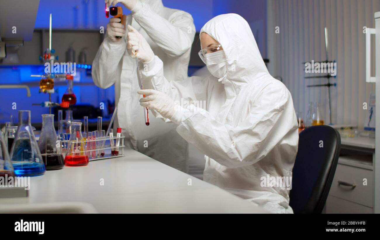 Biologist examining a virus sample in laboratory Stock Photo - Alamy