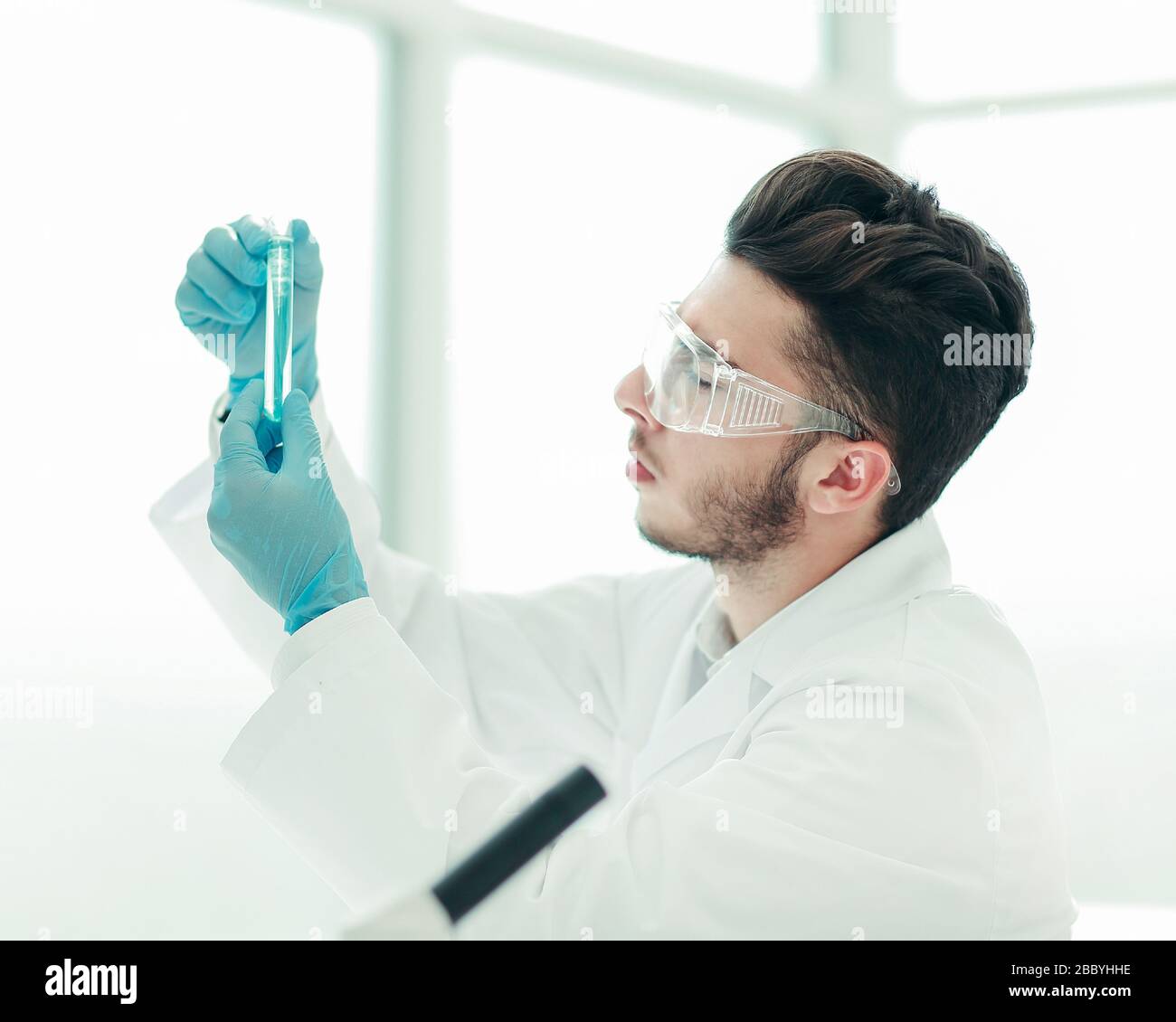 close up. scientist with a medical tube standing in the lab Stock Photo ...