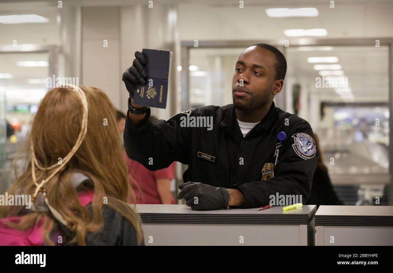 U.S. Customs and Border Protection officers screen international ...