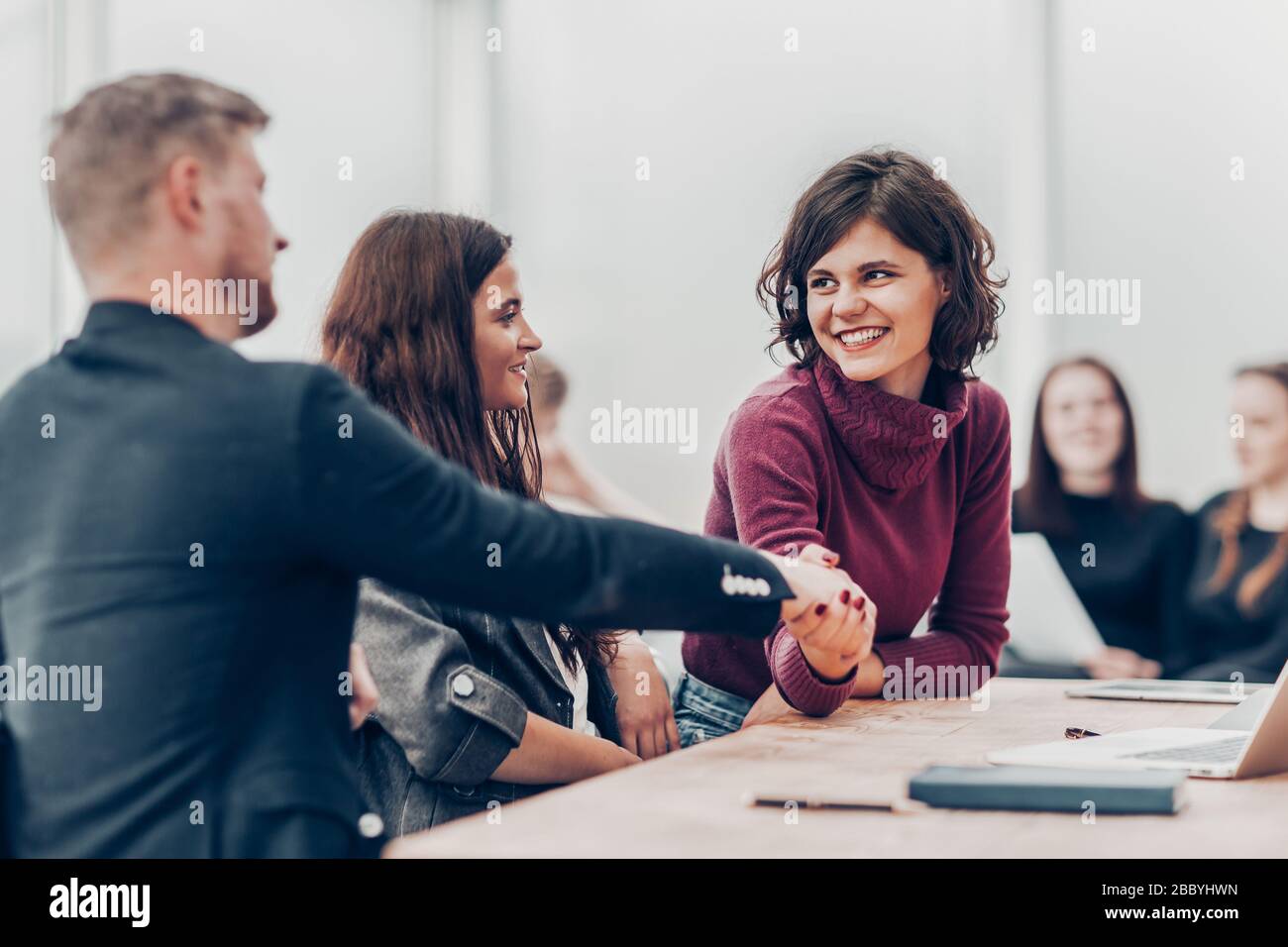 close up. Manager and customer shaking hands Stock Photo - Alamy