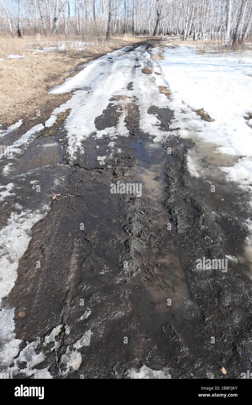 Spring dirty road Stock Photo - Alamy