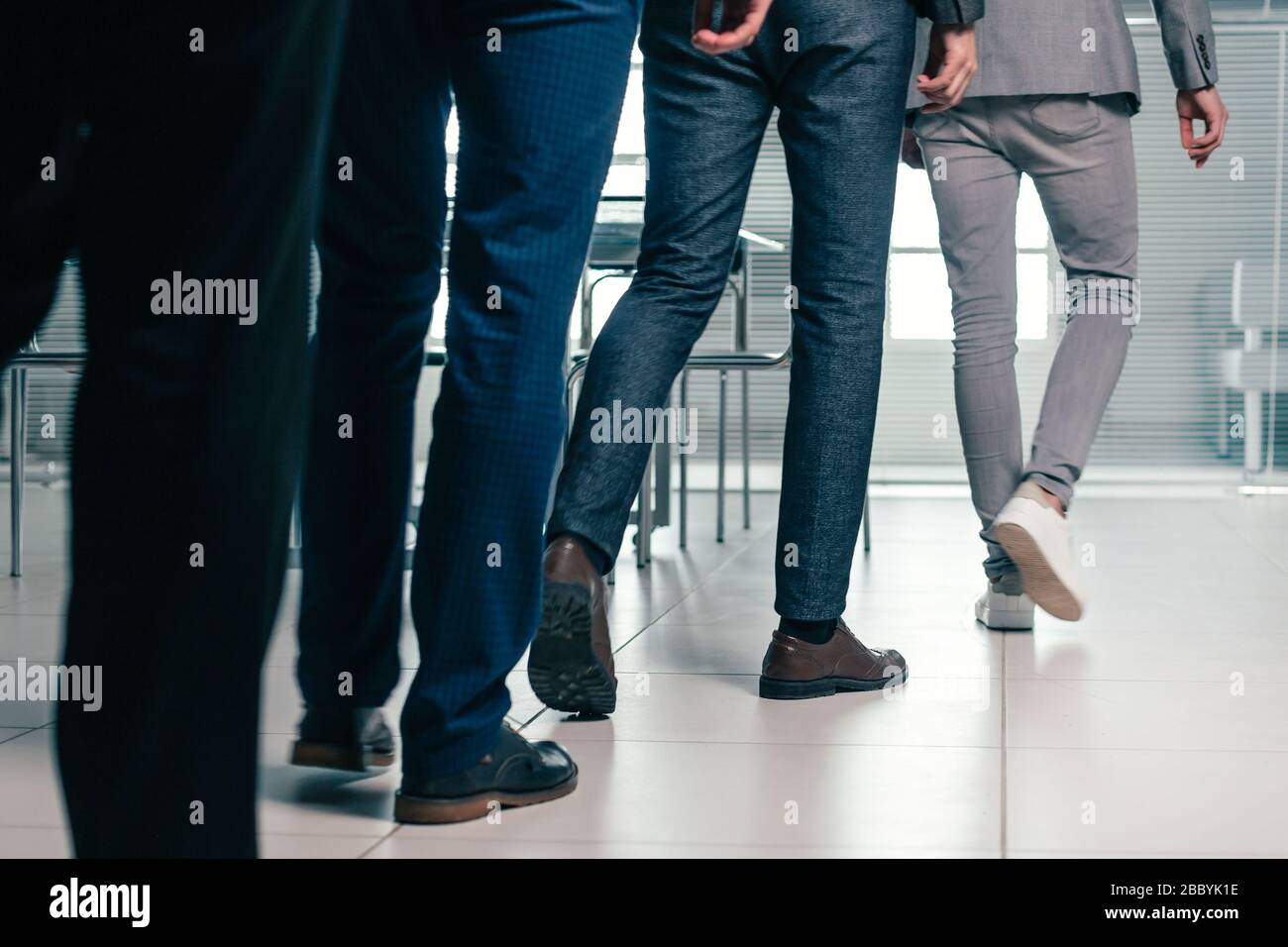 close up. office employees entering the work office Stock Photo - Alamy