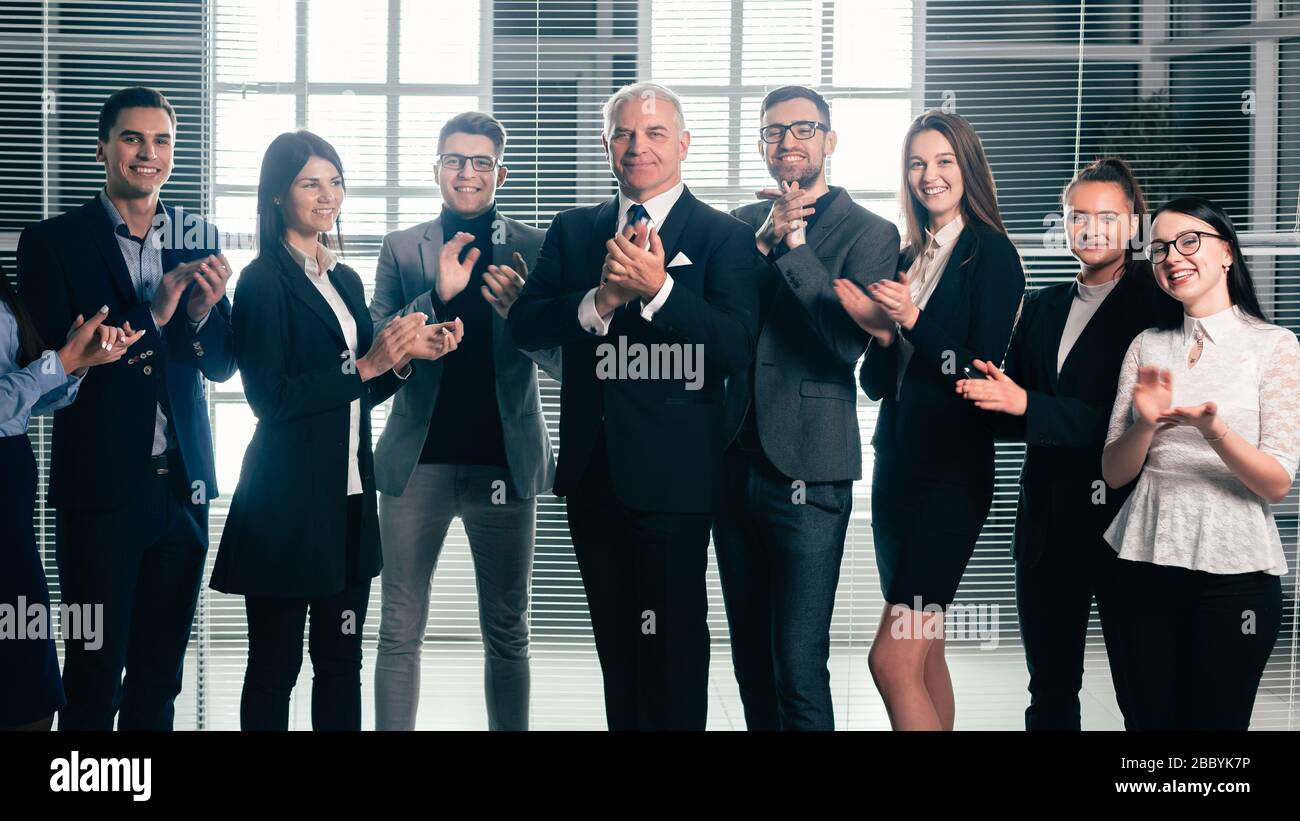 group of happy employees applauding their success Stock Photo - Alamy