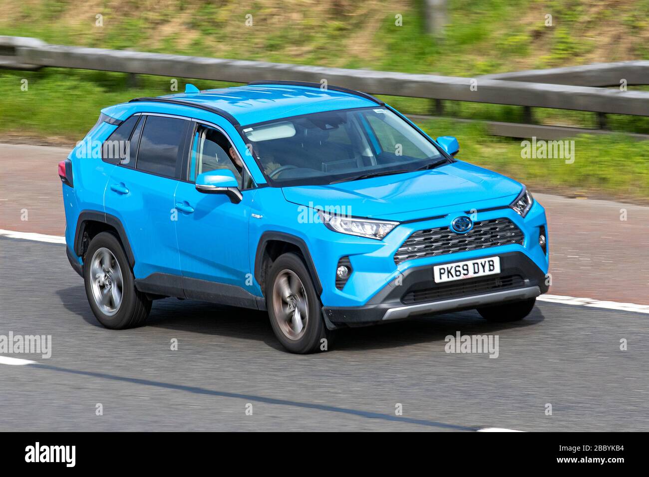 2019 blue Toyota Rav4 Design HEV CVT; Vehicular traffic moving vehicles ...