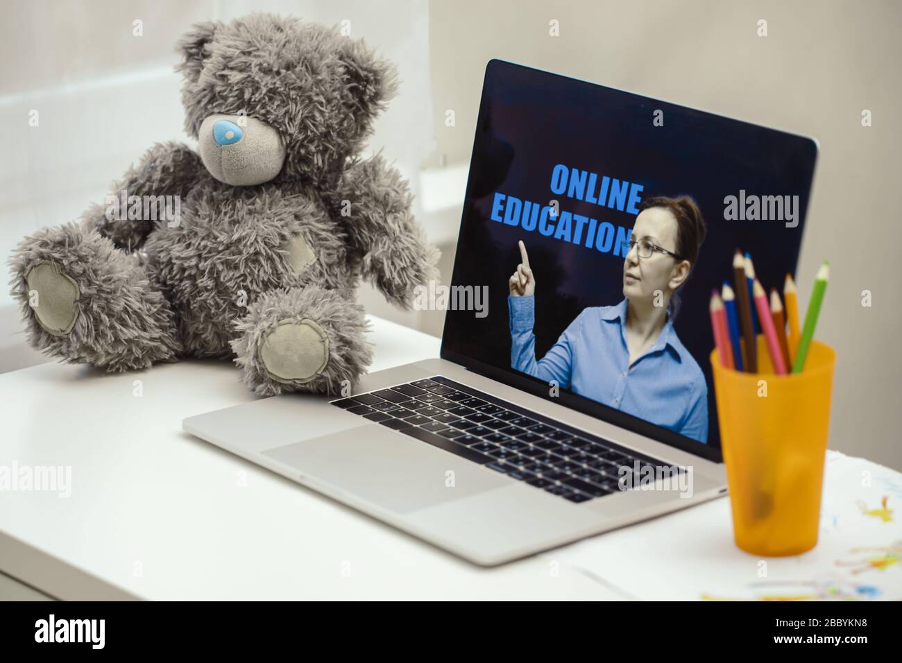 Online education concept. Webinar on a laptop screen. A female coach ...