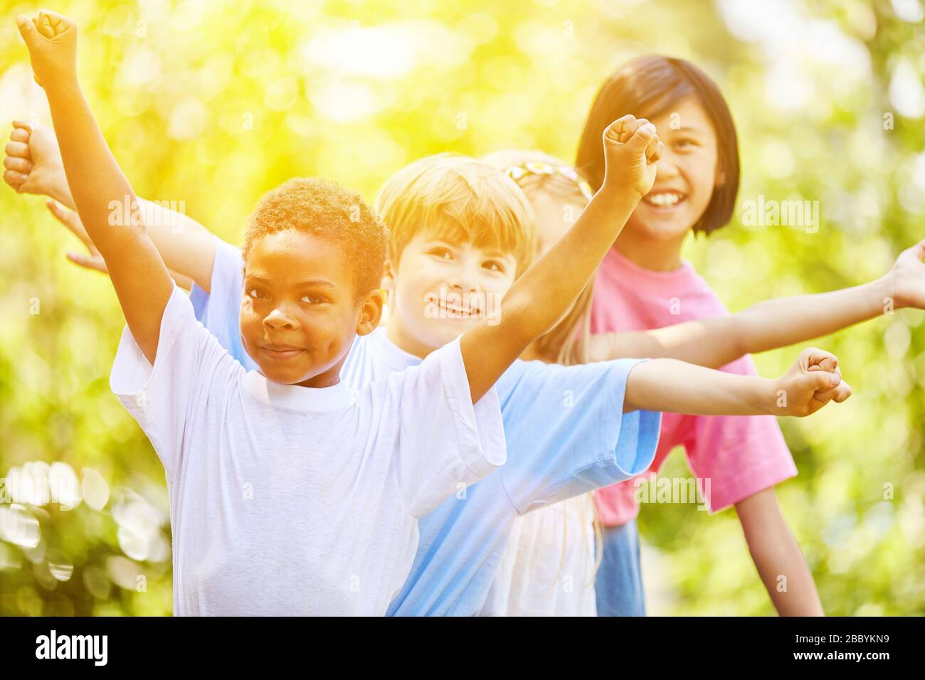 Multicultural group of children celebrate a children's birthday ...