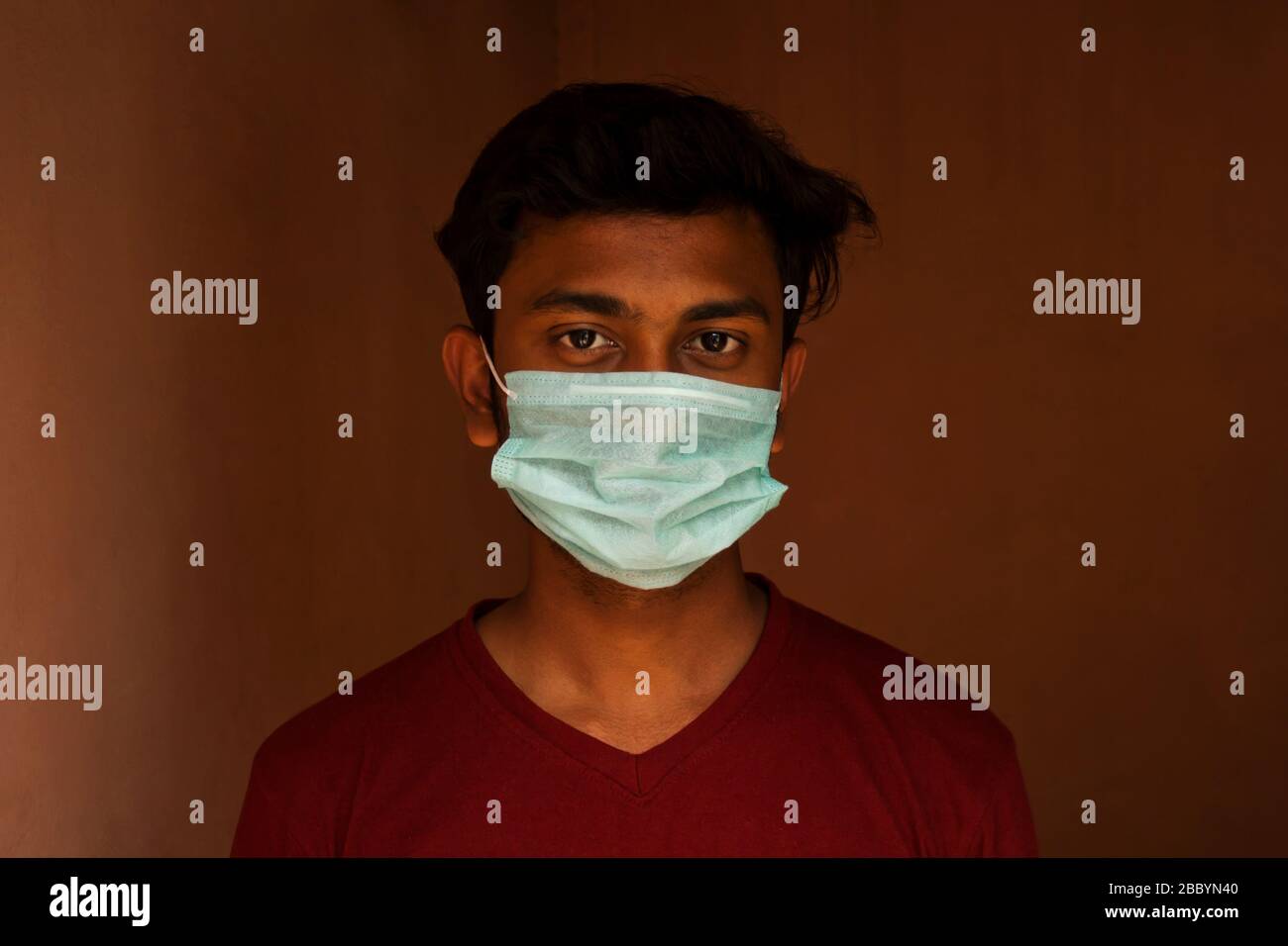 Young Boy wearing protective face mask Stock Photo - Alamy