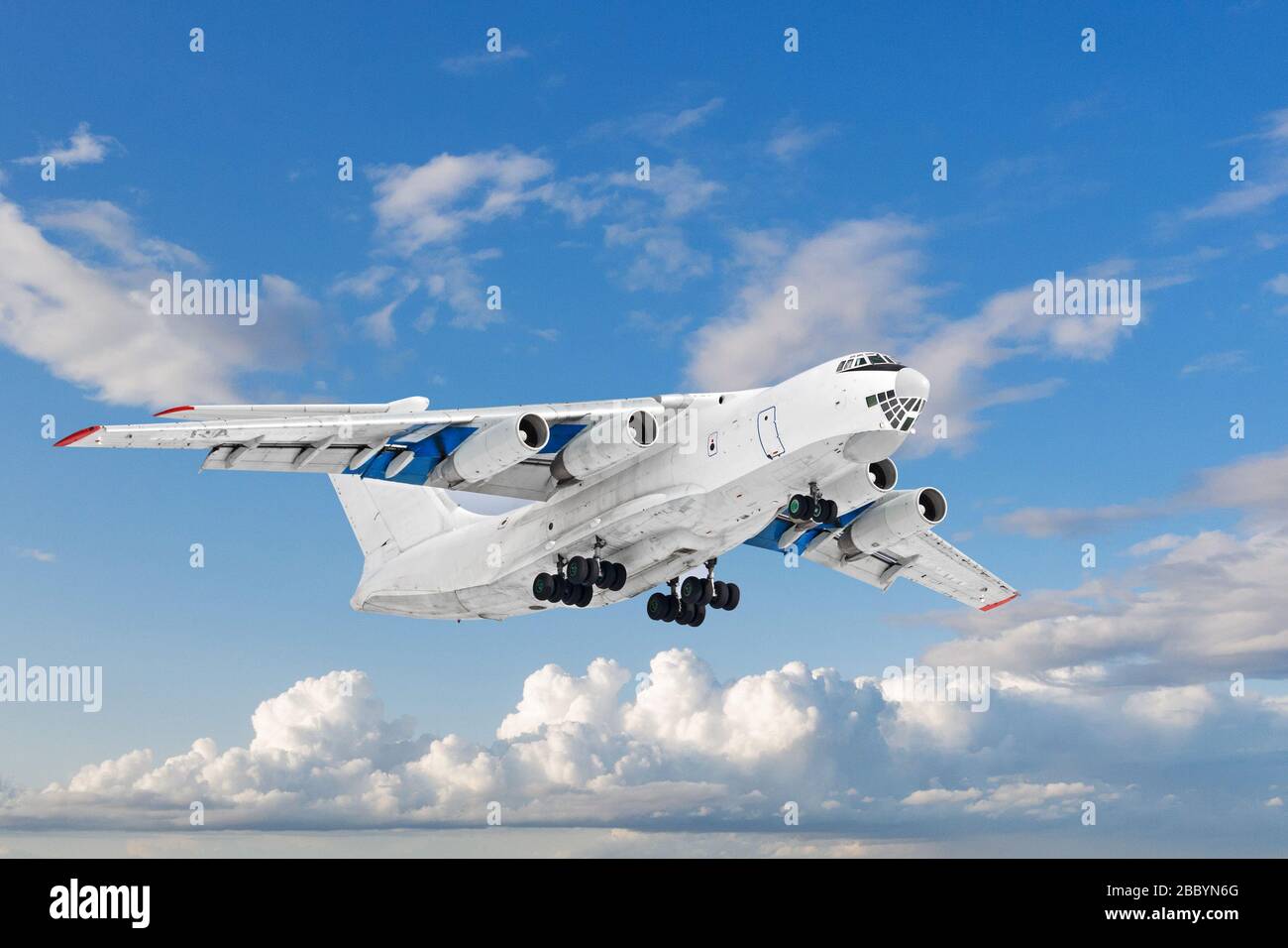 Large transport cargo plane flies in the sky. Delivery of goods and ...
