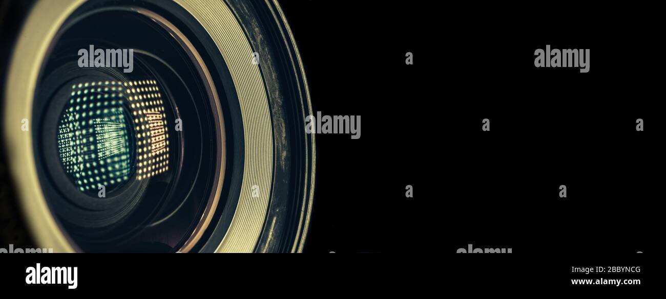 CLOSE UP Beautiful camera lens with light reflection on a black ...