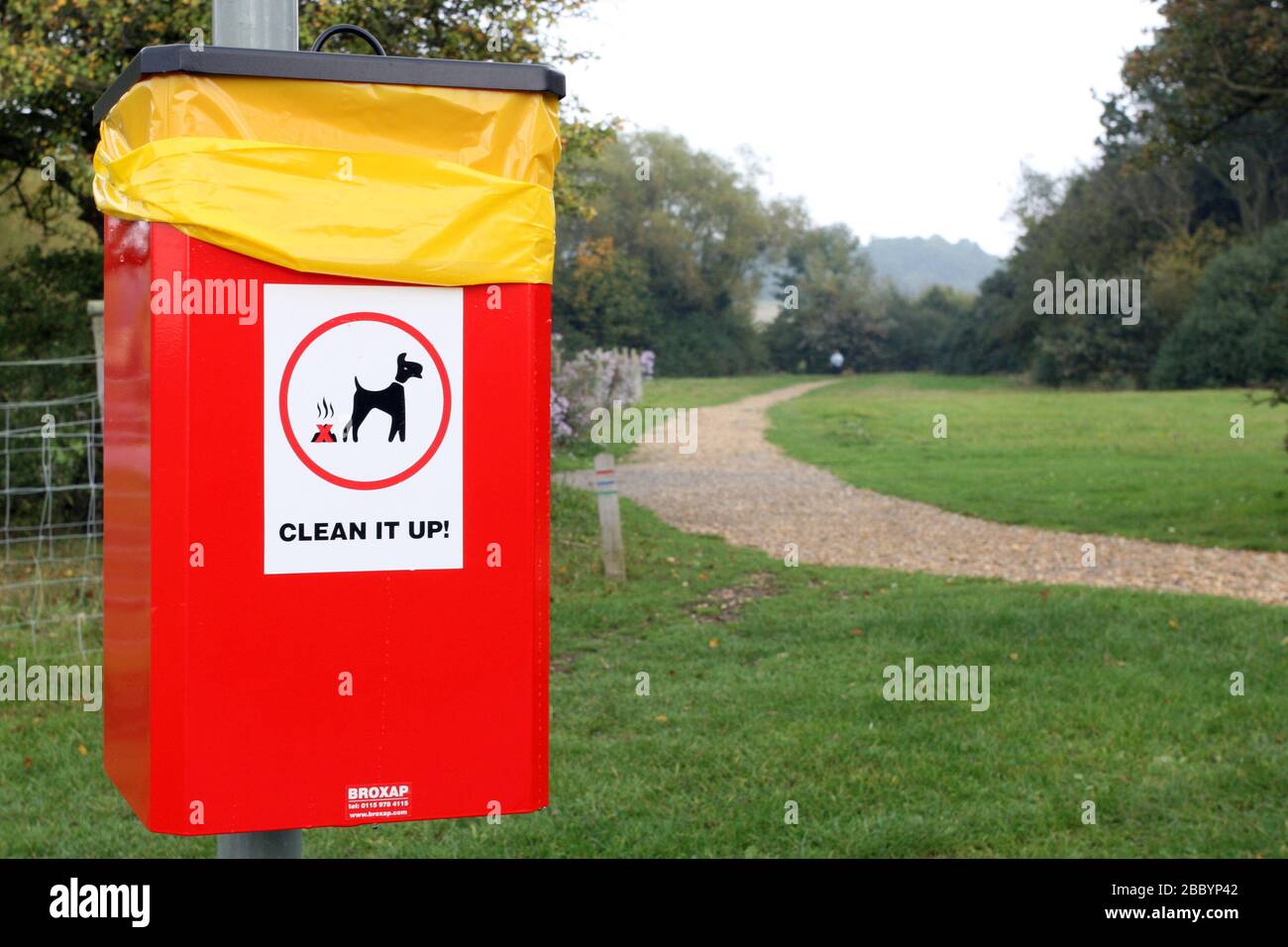 A bright red dog waste bin with Clean It Up! sign. Hainault Forest ...