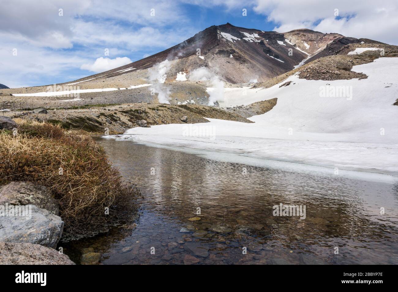 View of Asahidake (Mount Asahi) in Japan, taken in June. View shows the ...