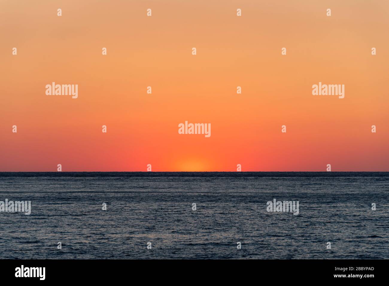 Mediterranean sea as the sun starts to rise and colour it golden Stock ...