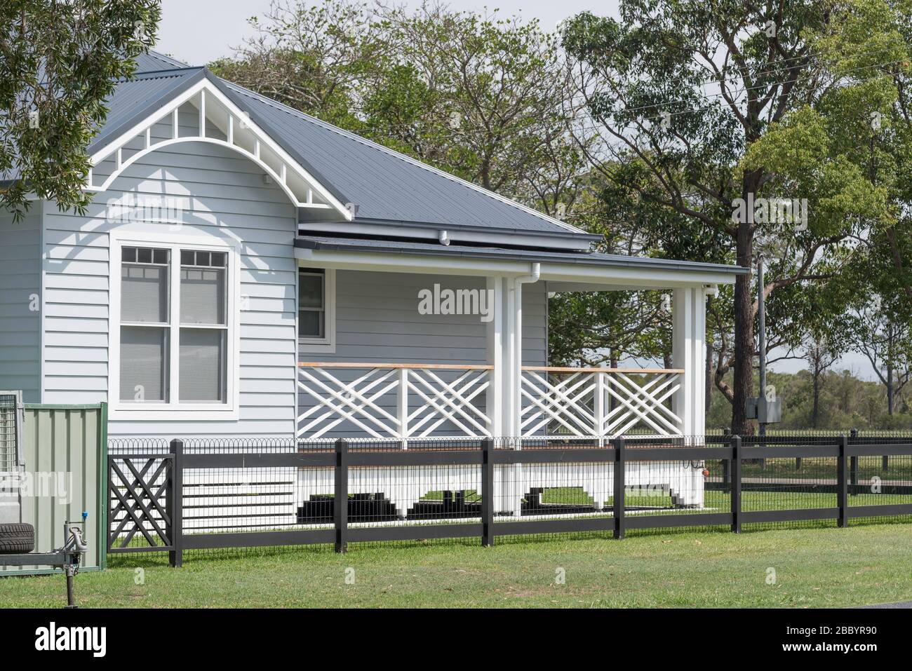 A single level Federation style bungalow home with a post and rail wire ...