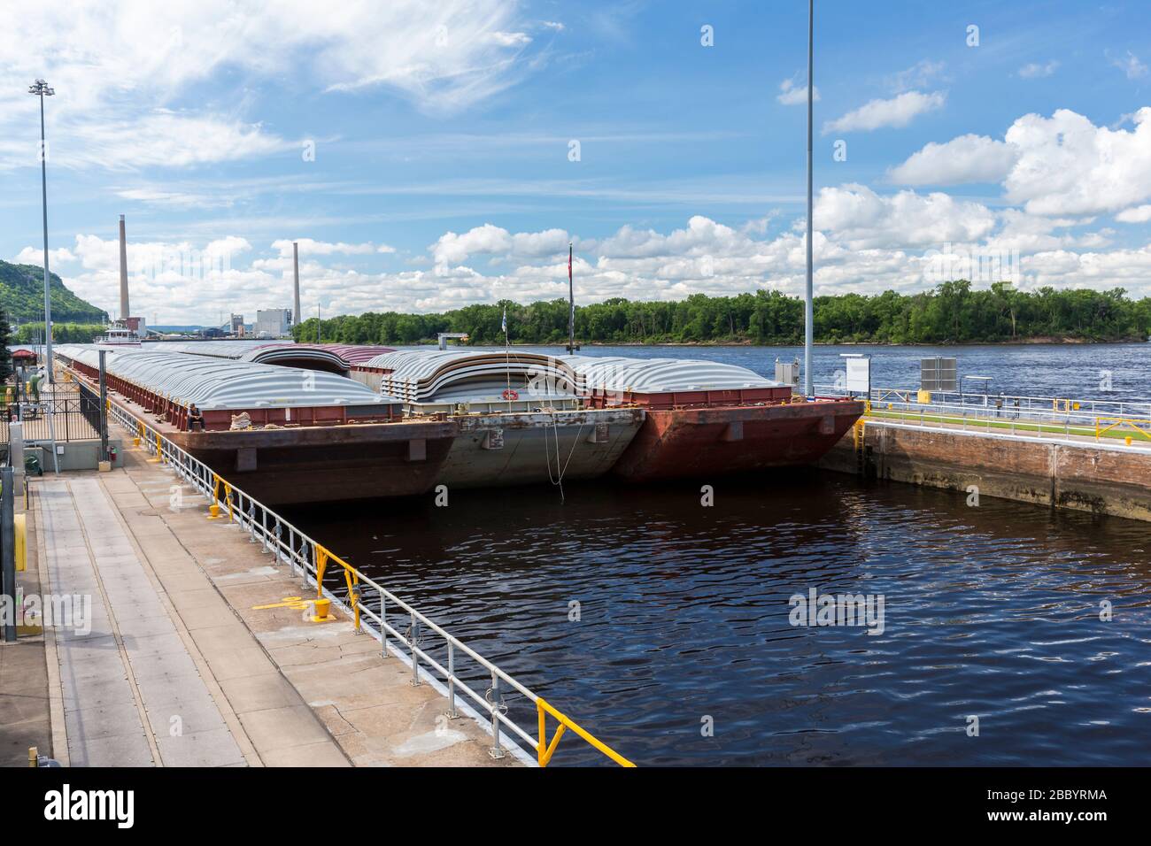 A barge entering a lock and dam on the Mississippi River Stock Photo ...