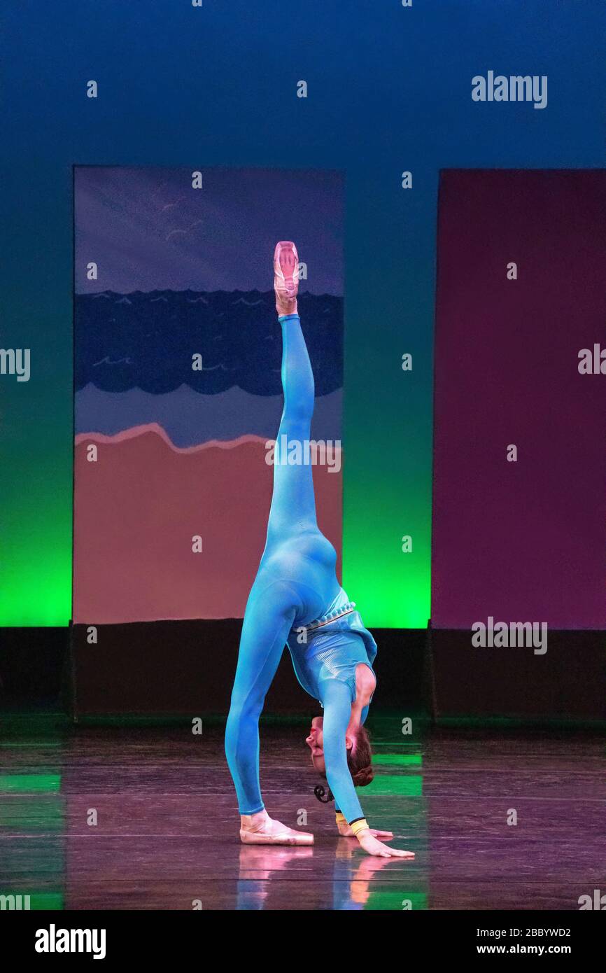Ballet dancer performing as the caterpillar in Alice in Wonderland ...