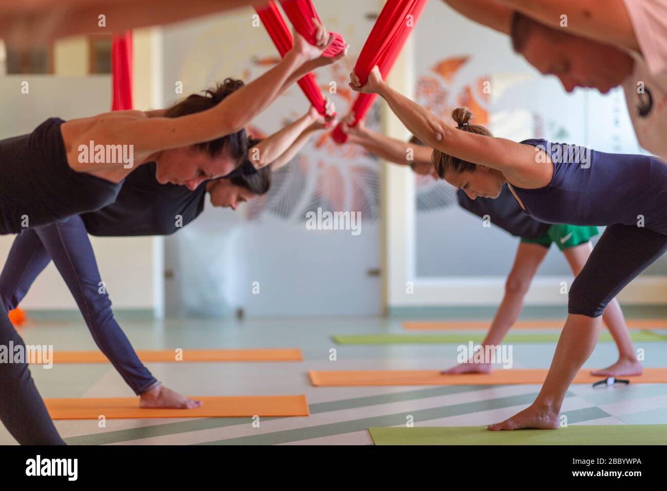 Aerial yoga class in progress Stock Photo - Alamy