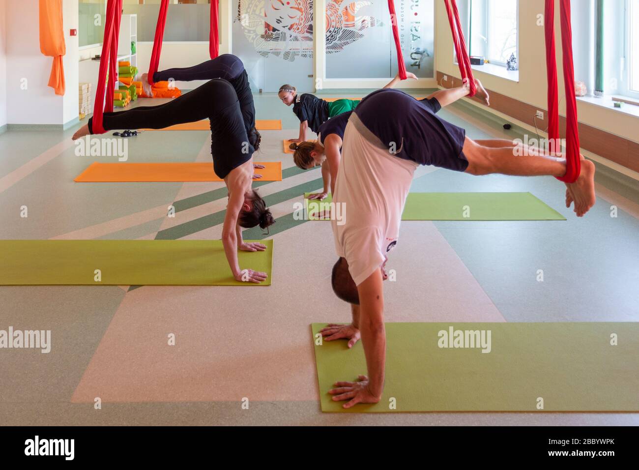 Aerial yoga class in progress Stock Photo - Alamy
