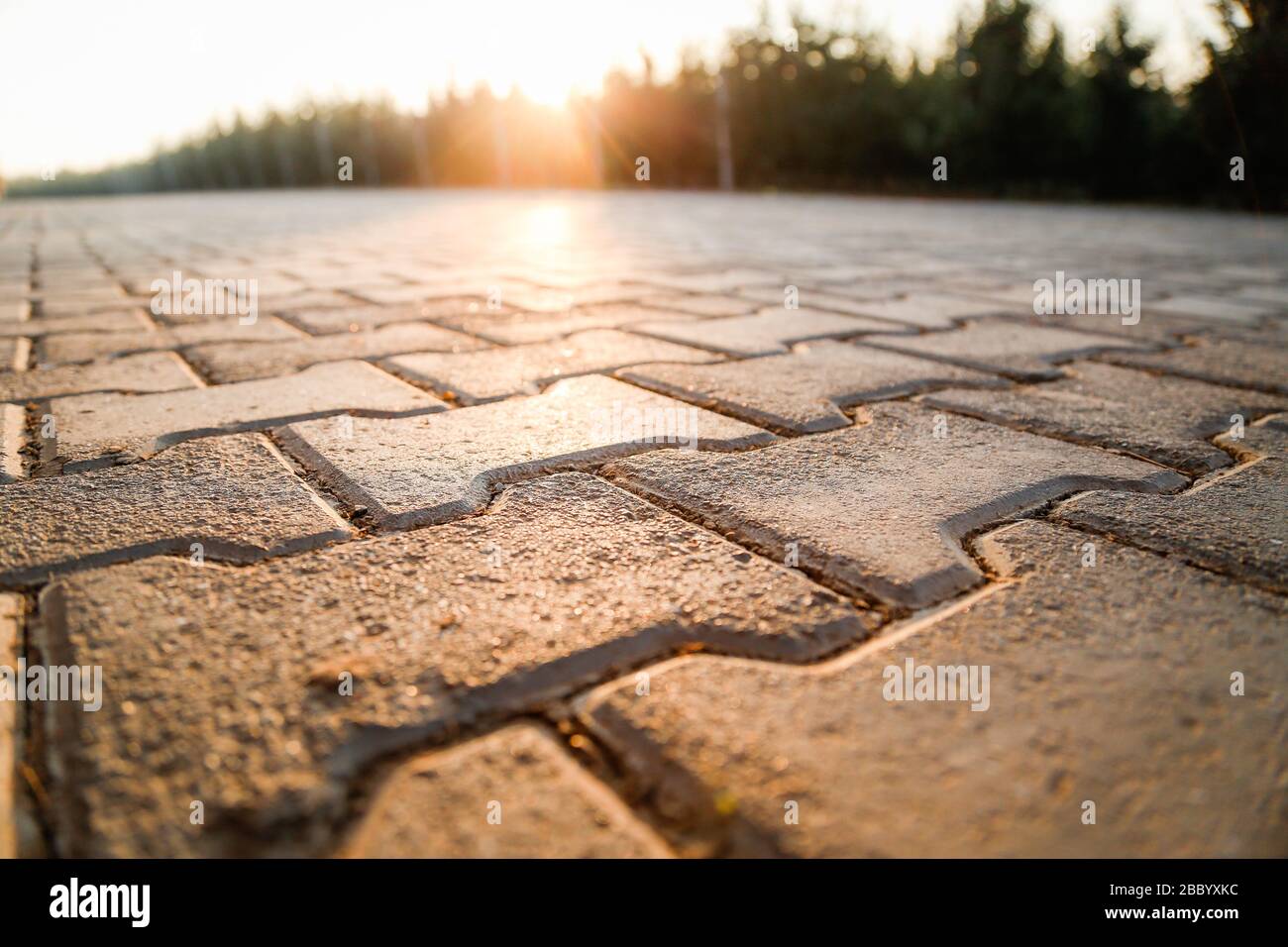 gray pavement on sunrise background Stock Photo - Alamy