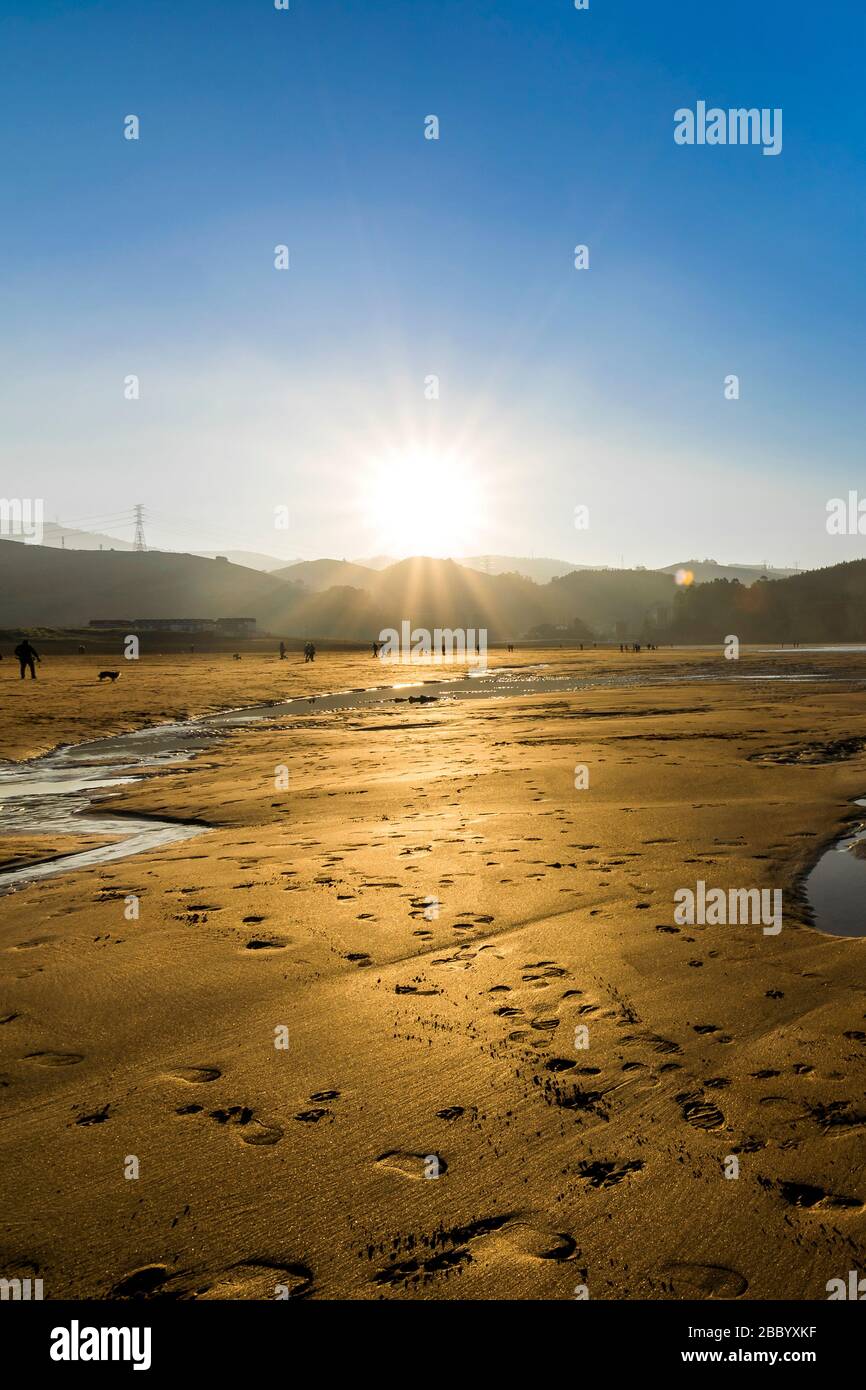 Footprints on empty beach at sunset hi-res stock photography and images ...