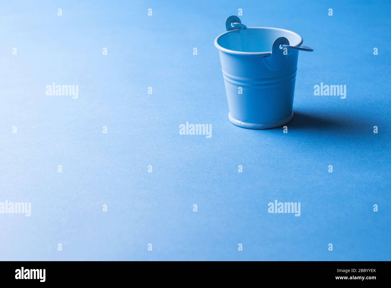 A metal garden bucket of blue color, miniature size. Classic blue ...