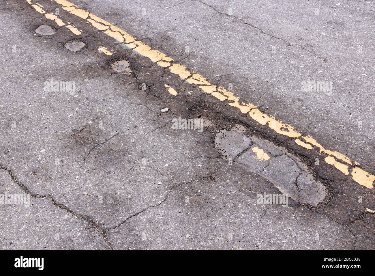 Pothole road - damaged roadway surface in California, USA Stock Photo ...