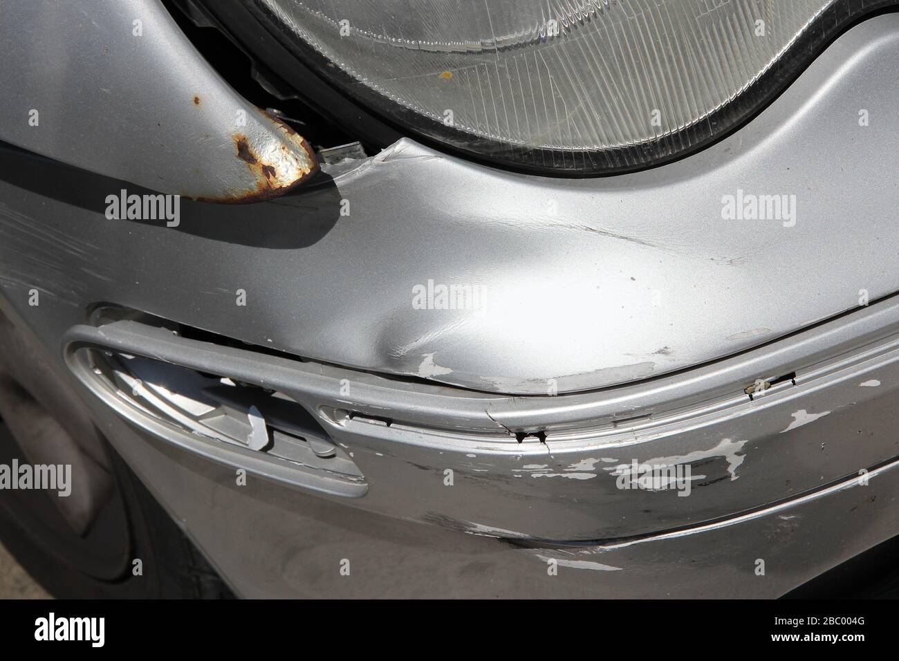 Generic car with unrepaired accident damage - rust overcoming bent ...