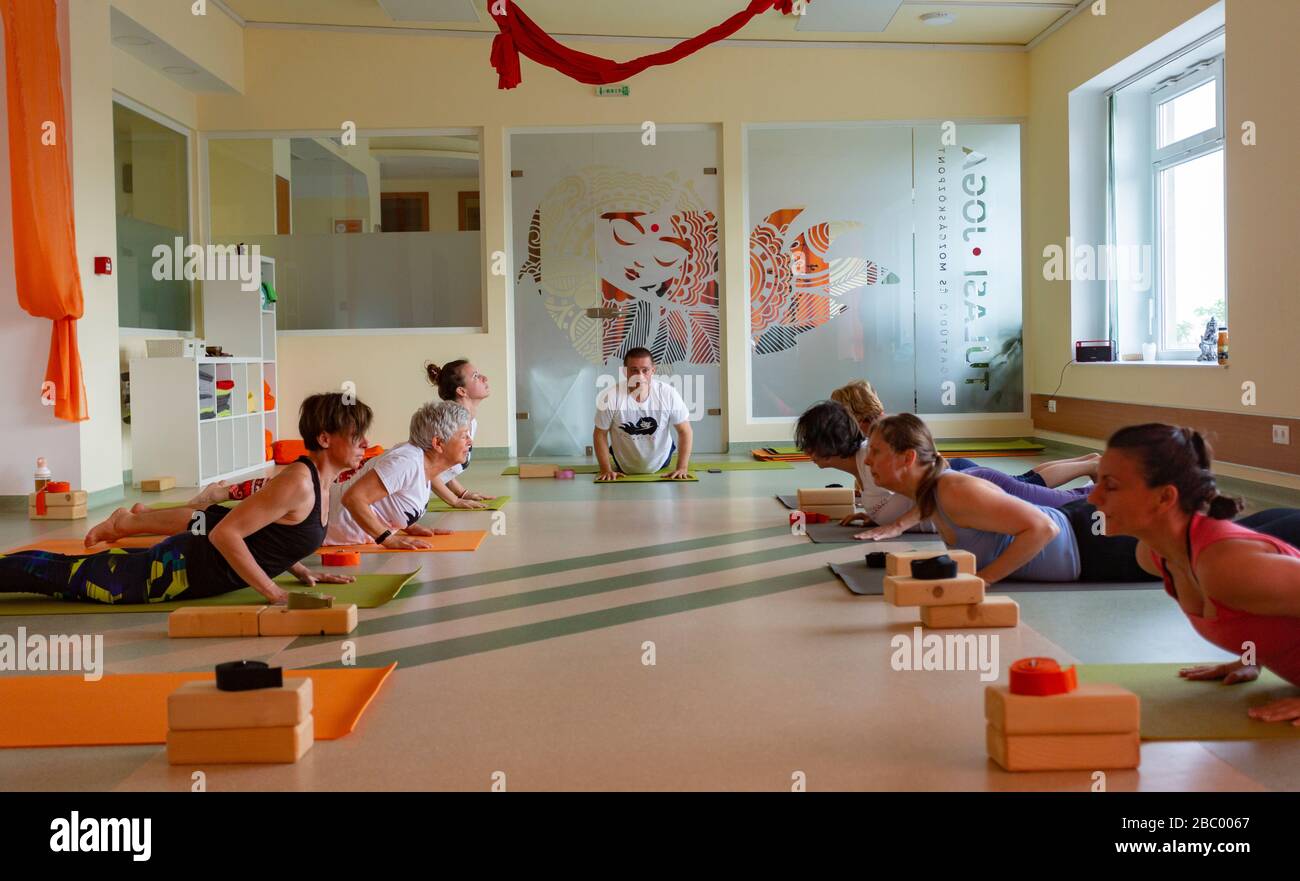 Yoga class in progress Stock Photo - Alamy