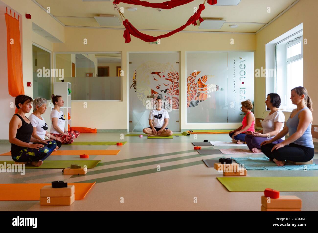 Yoga class in progress Stock Photo - Alamy