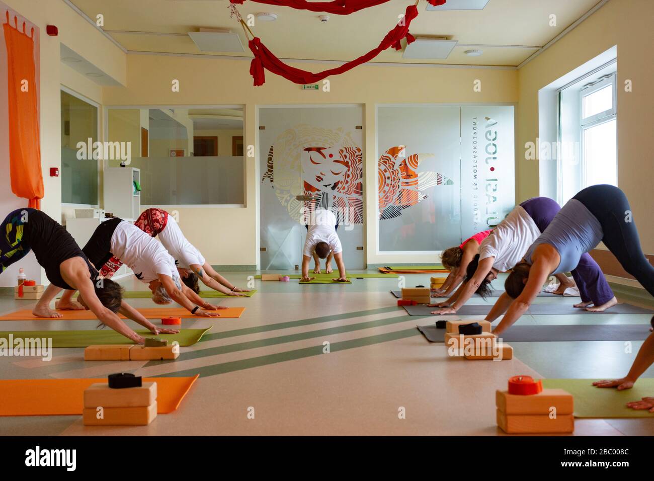 Yoga class in progress Stock Photo - Alamy